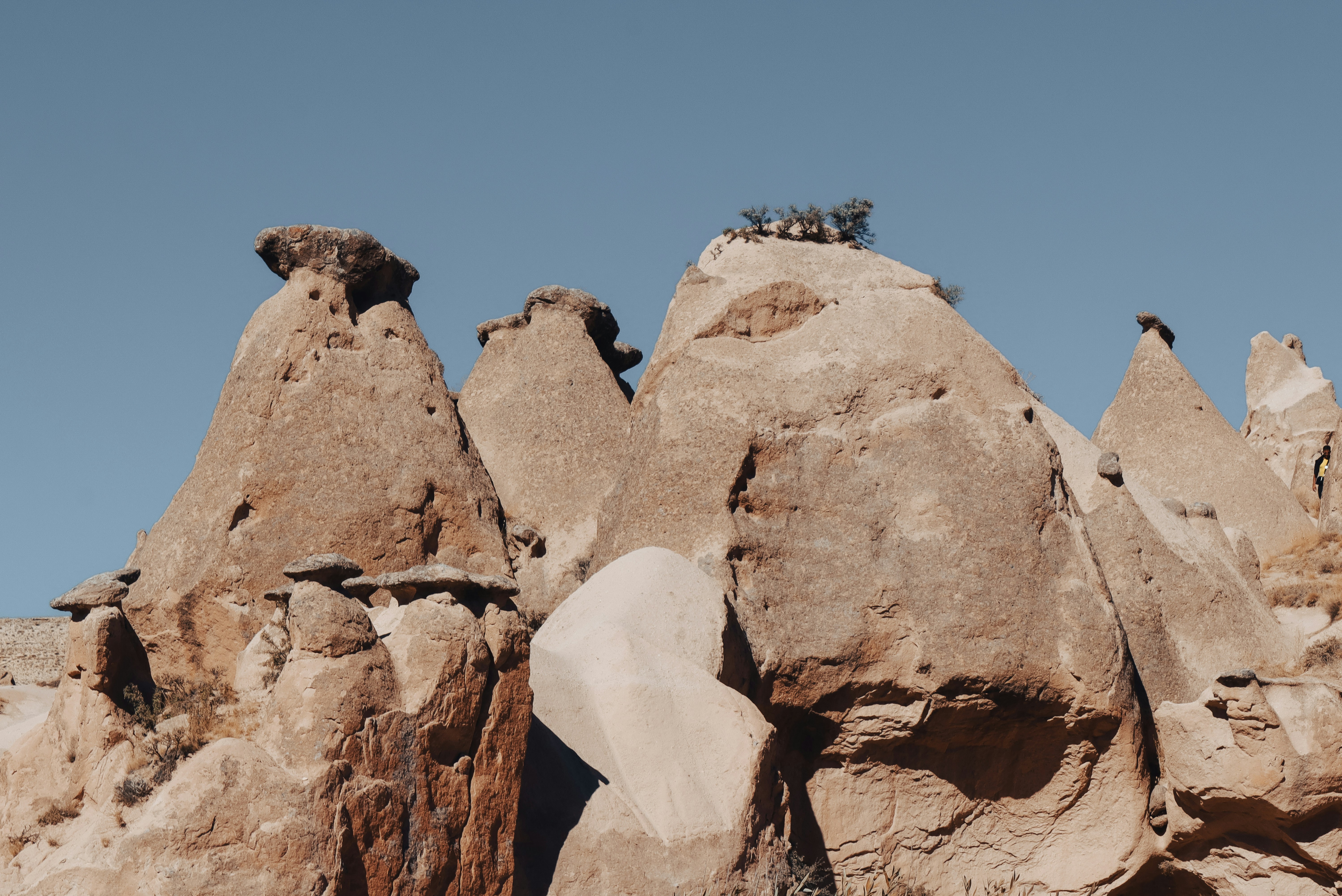 Fairy Chimneys Formed by the Erosion of Soft Tuffs | Unusual rock formations under a clear blue sky