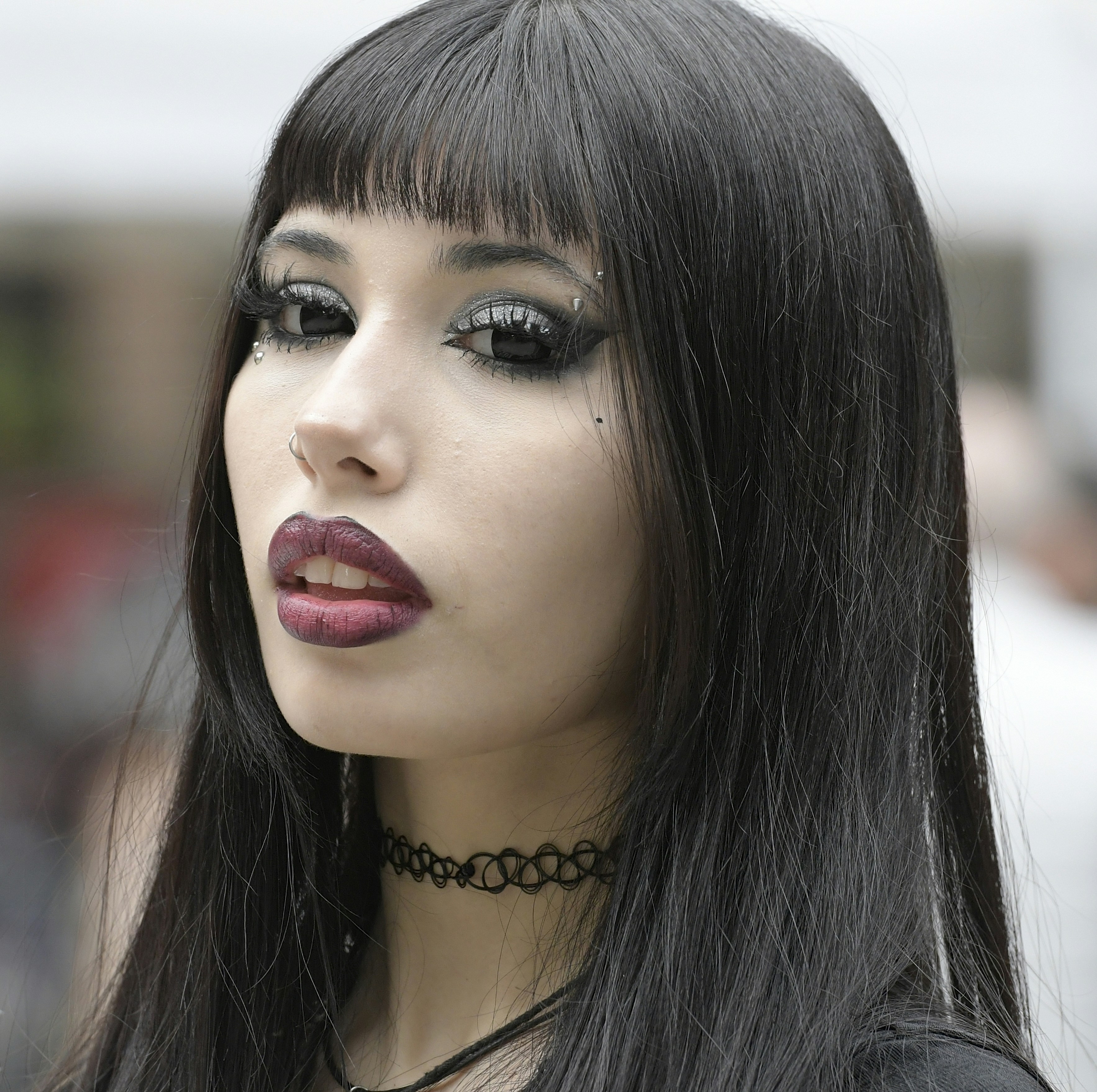 Gilded Gaze in Velvet Noir: Close-Up Portrait with Smoky Eyes