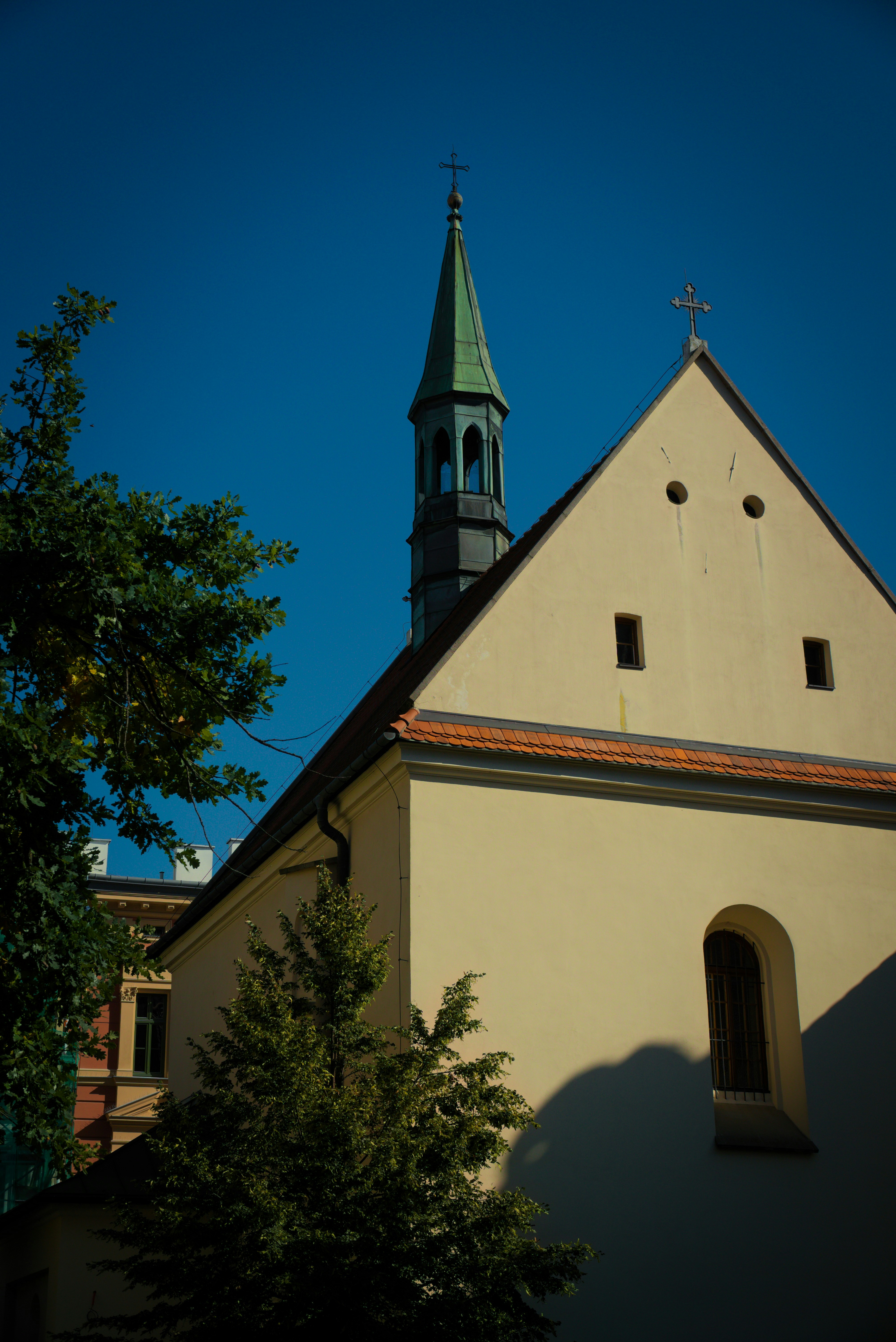 A church steeple against a clear blue sky.