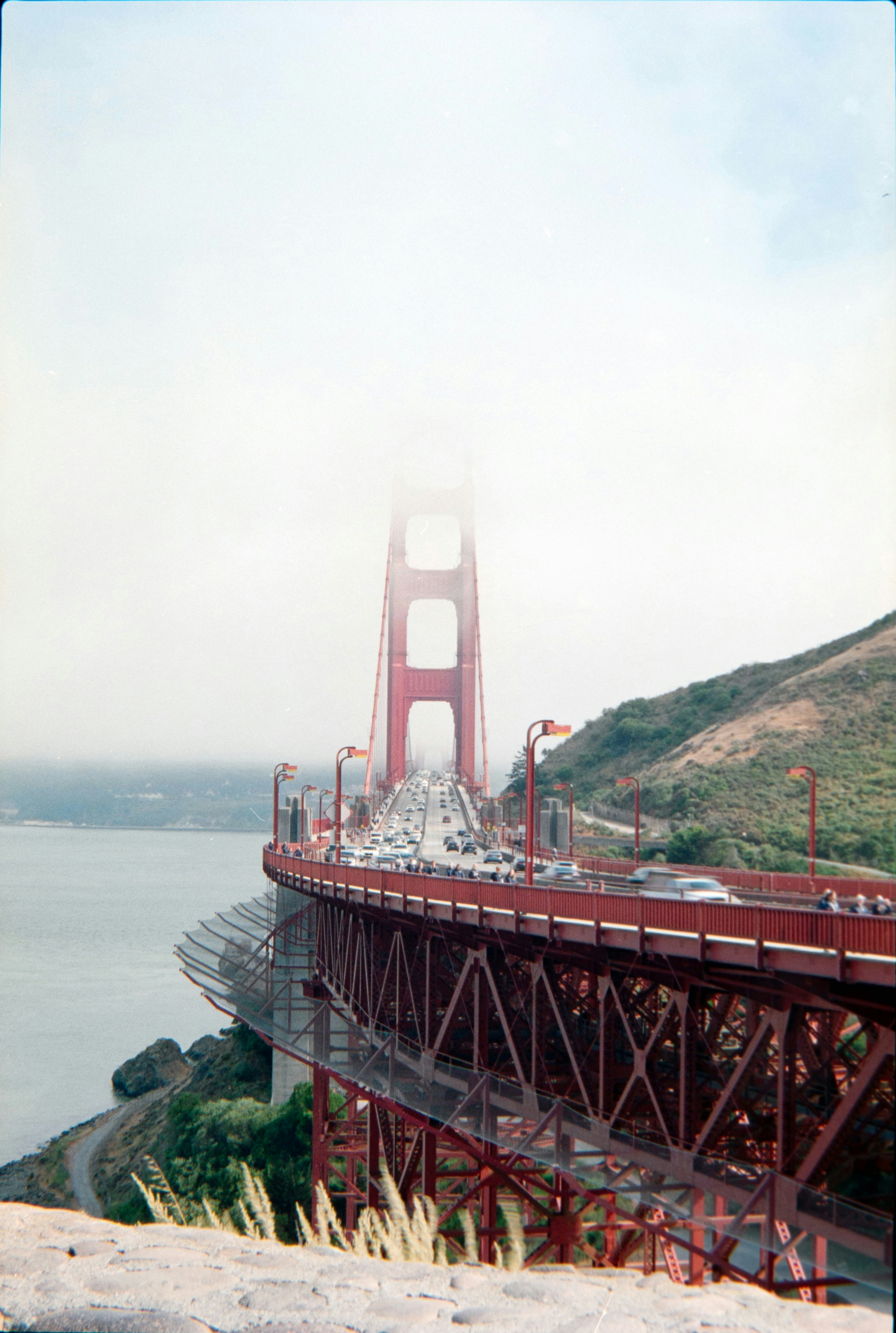 Instagram: @plouzek_barlow_photography Canon A-1 - Gold 200 | Golden gate bridge partially covered in fog