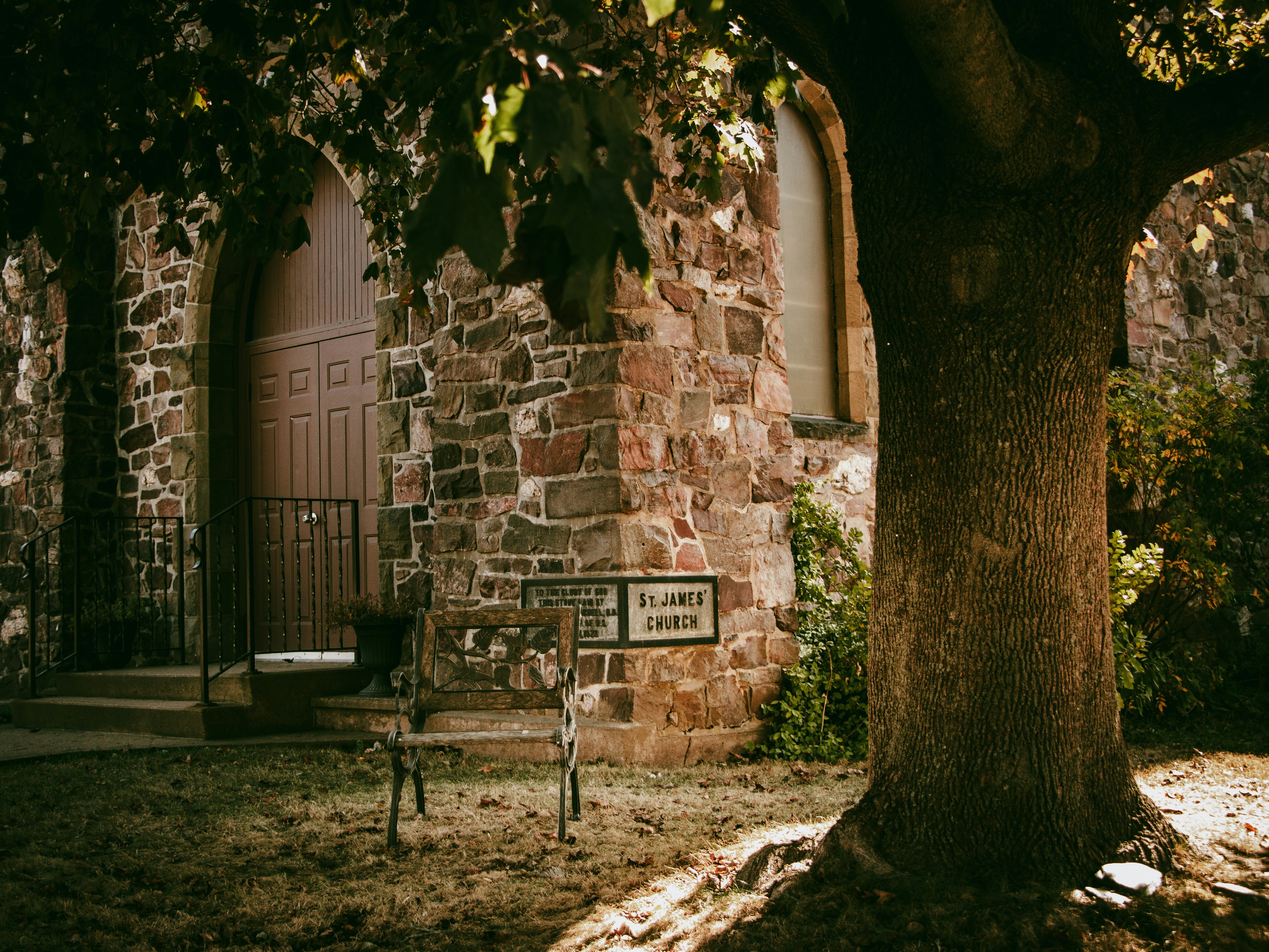 Autumn in Nova Scotia | Stone building with a large tree in foreground