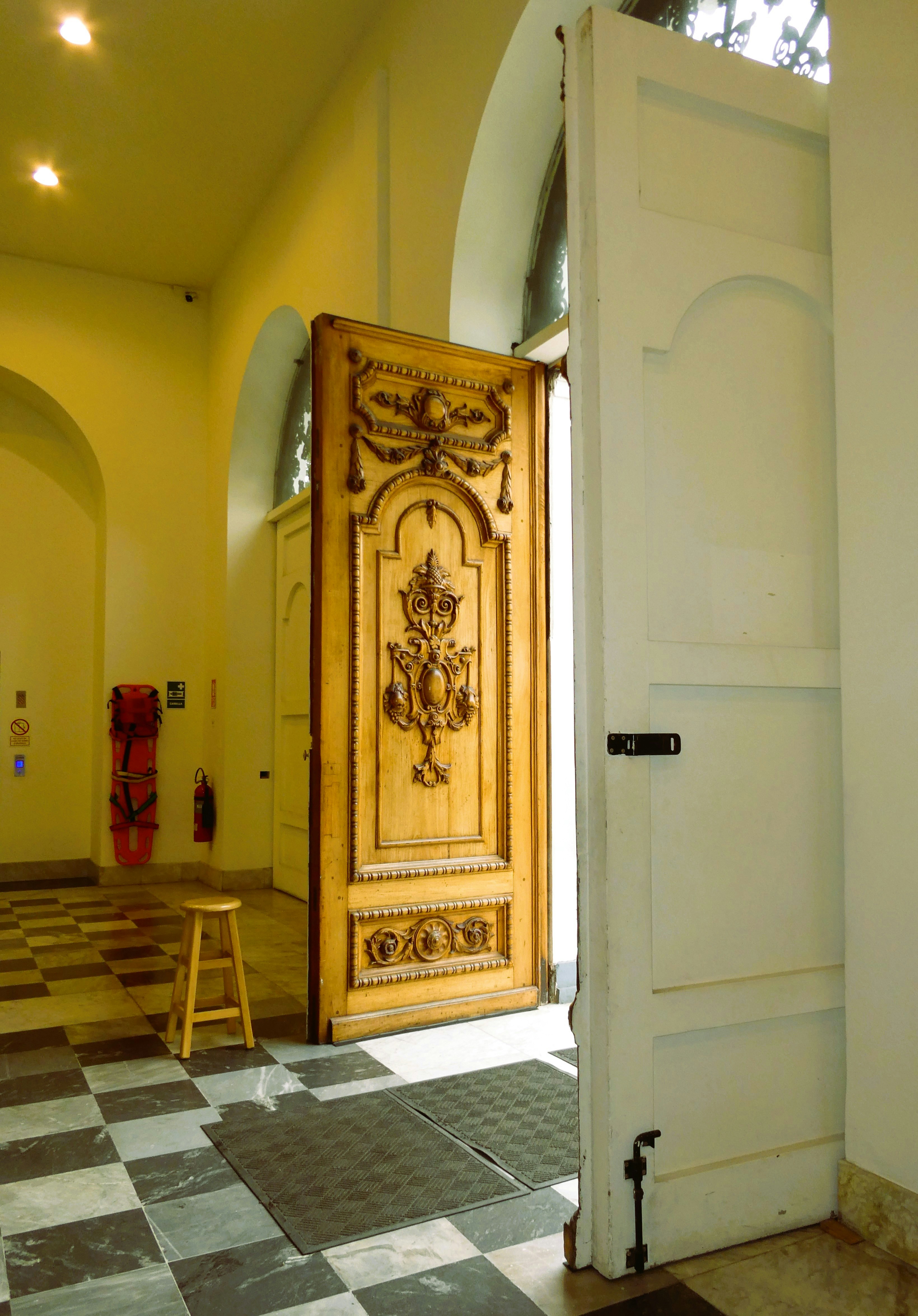 Lima Art Museum (Museo de Arte de Lima, MALI) | Ornate wooden door stands open in hallway