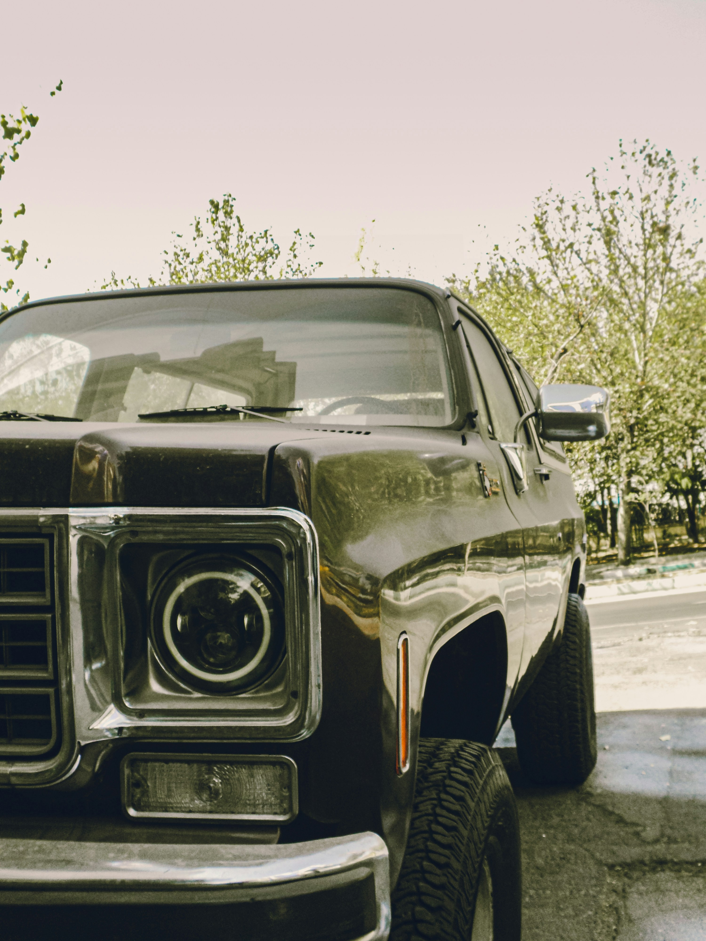 An old soul with new eyes. | Front view of a vintage dark pickup truck.