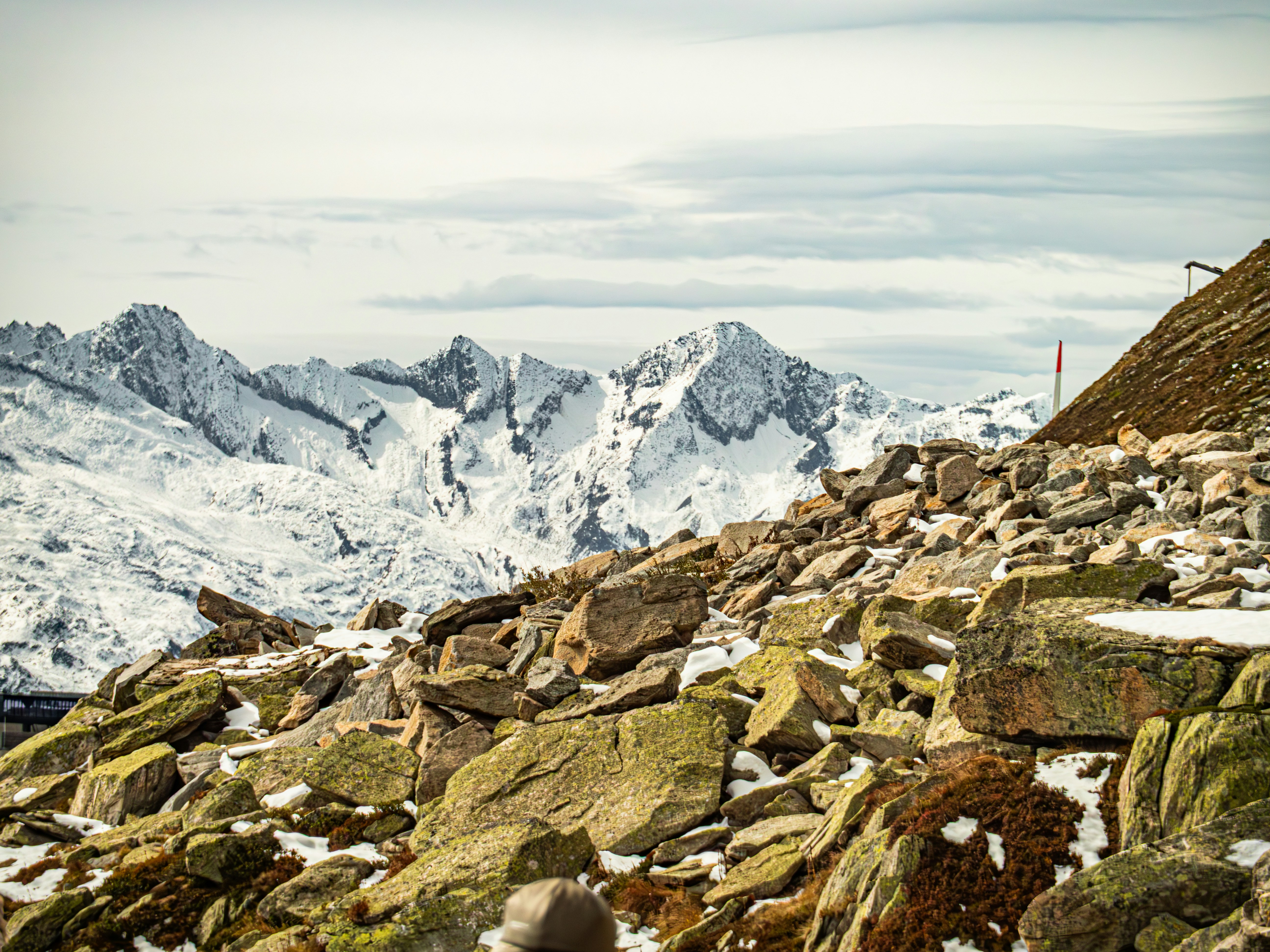 Stony Ascent Under Snow-Crowned Peaks