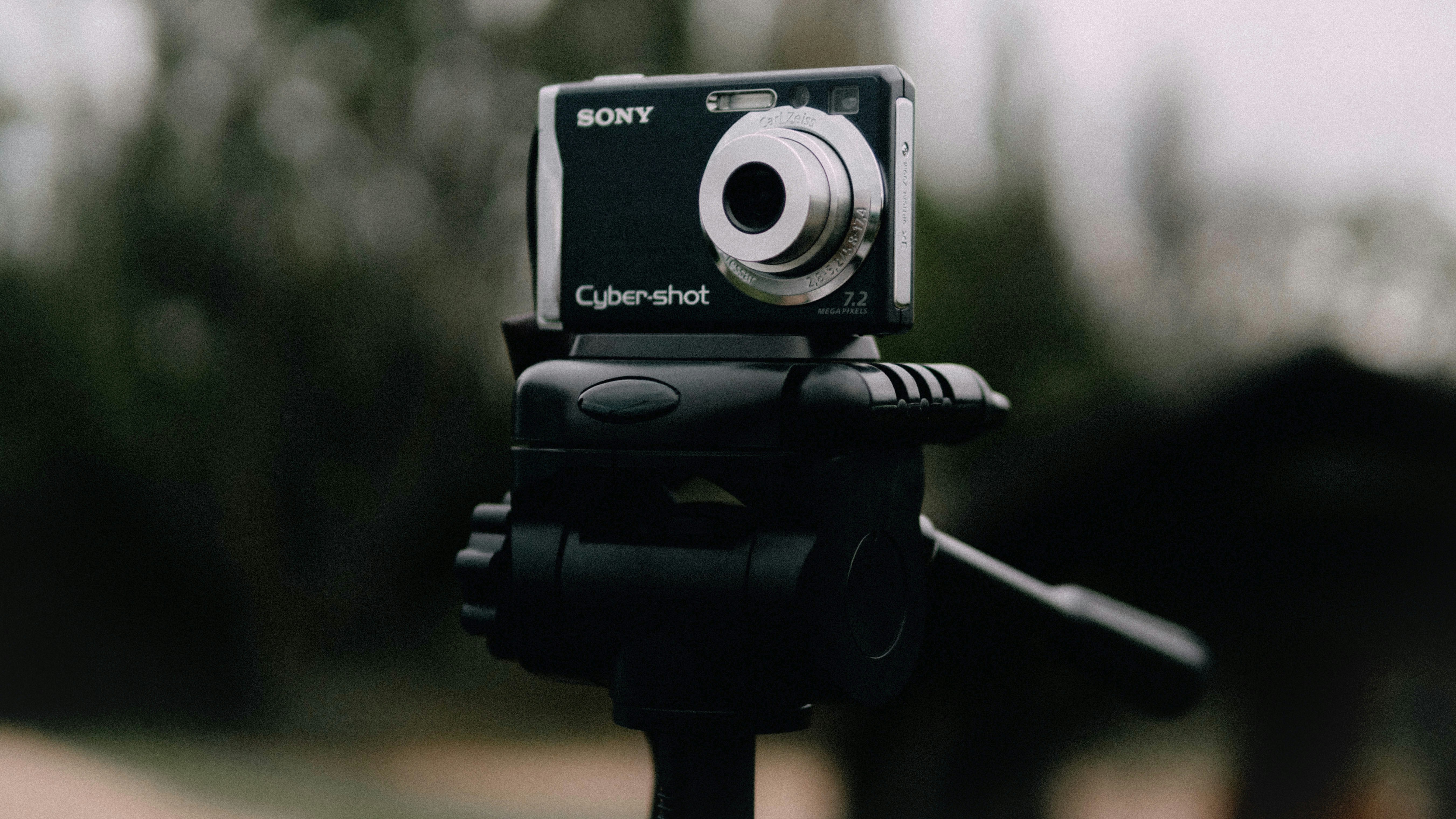 Digital camera mounted on a tripod outdoors