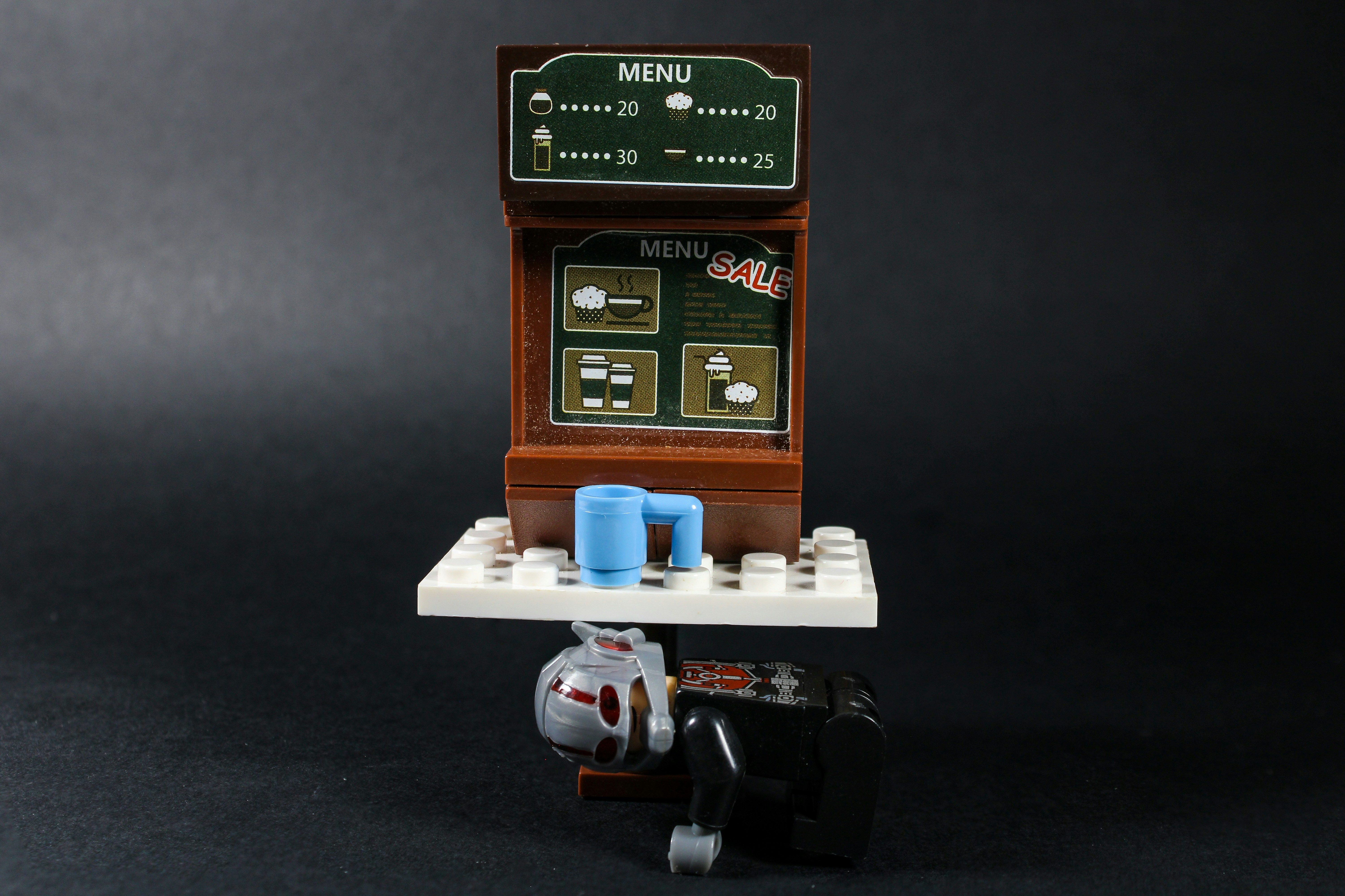 Brick-Sized Arcade: A LEGO Menu Diorama Beneath a Dark Backdrop