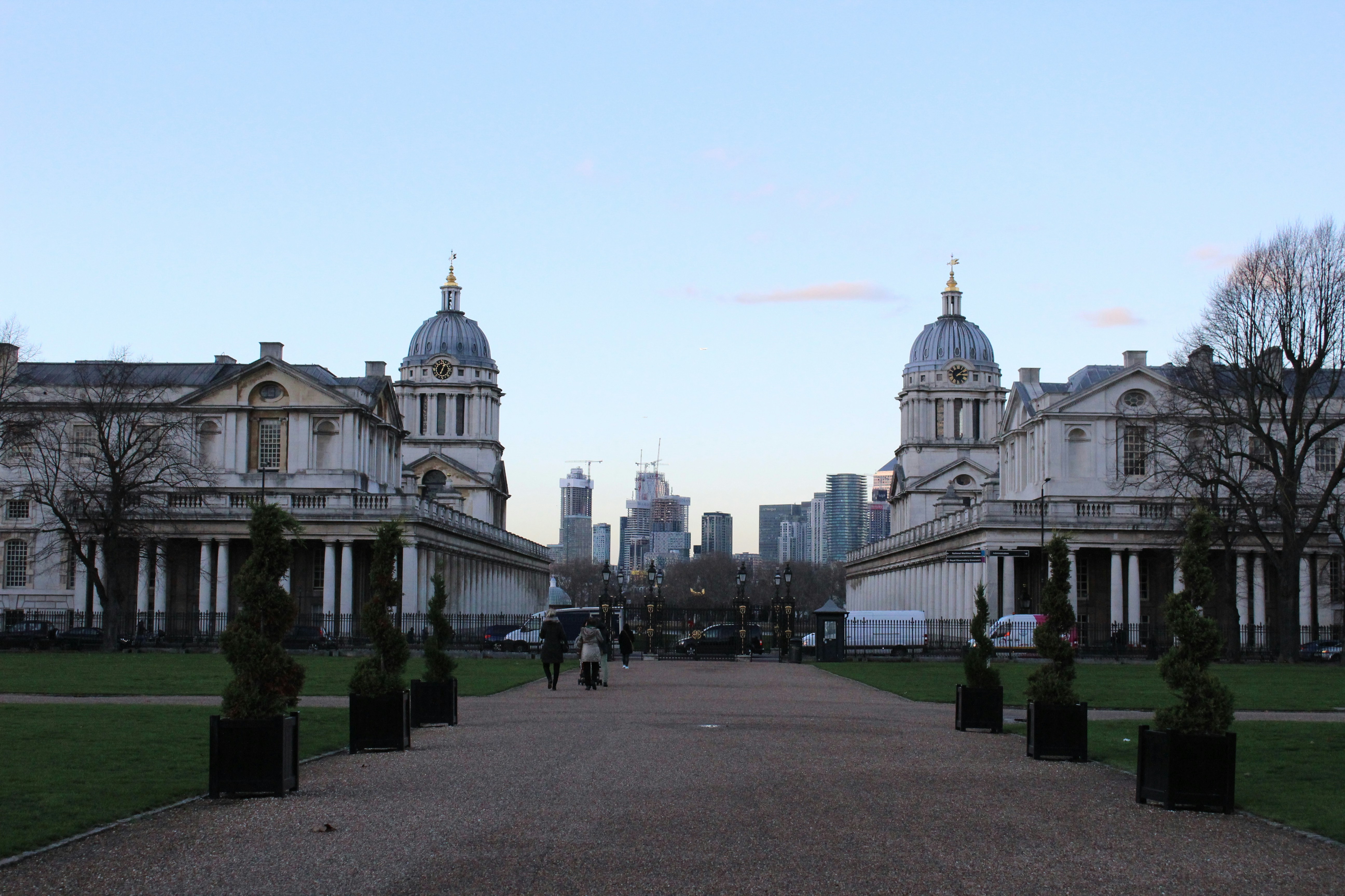 Grand buildings with domes and city skyline beyond
