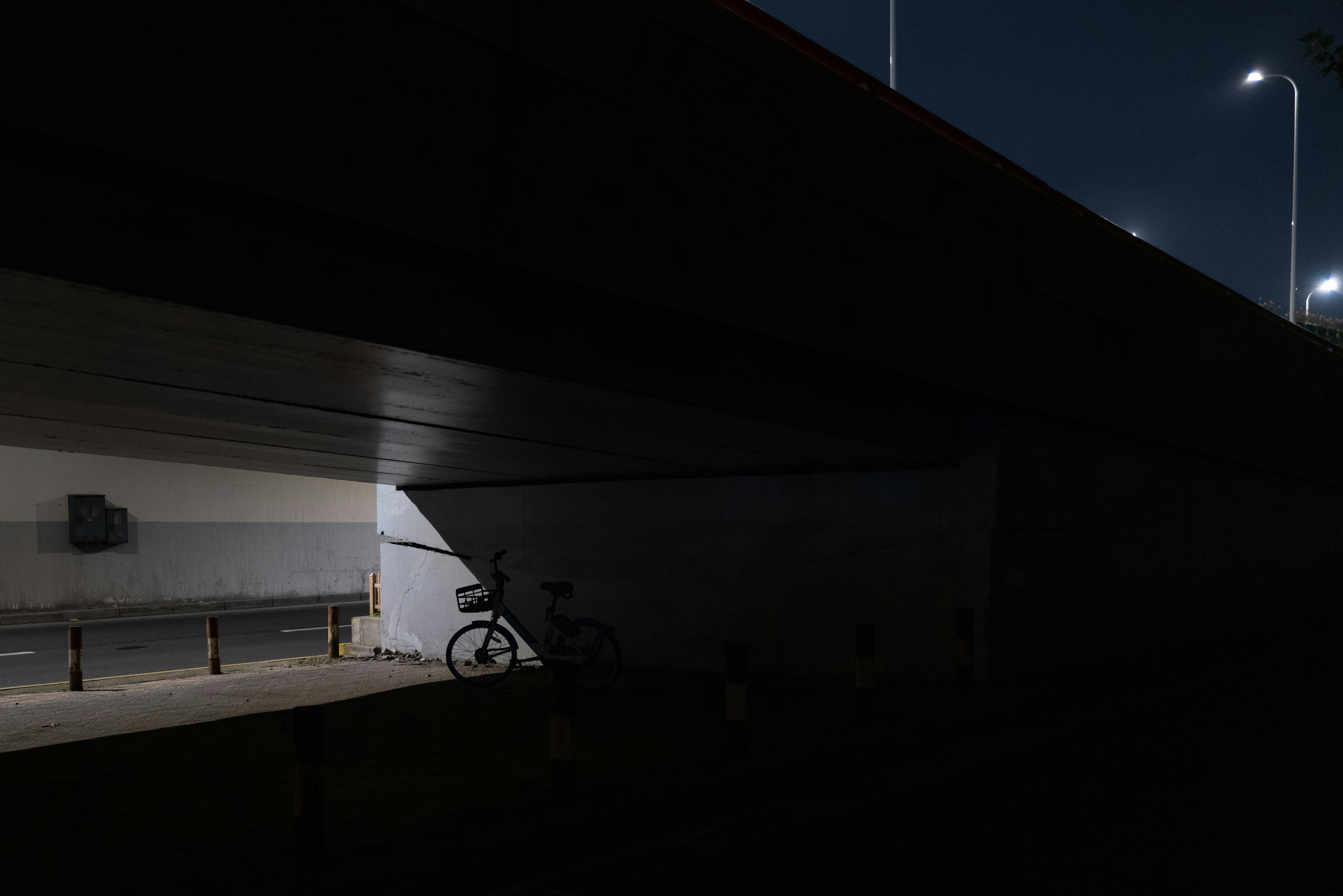 Urban Solitude Beneath the Overpass