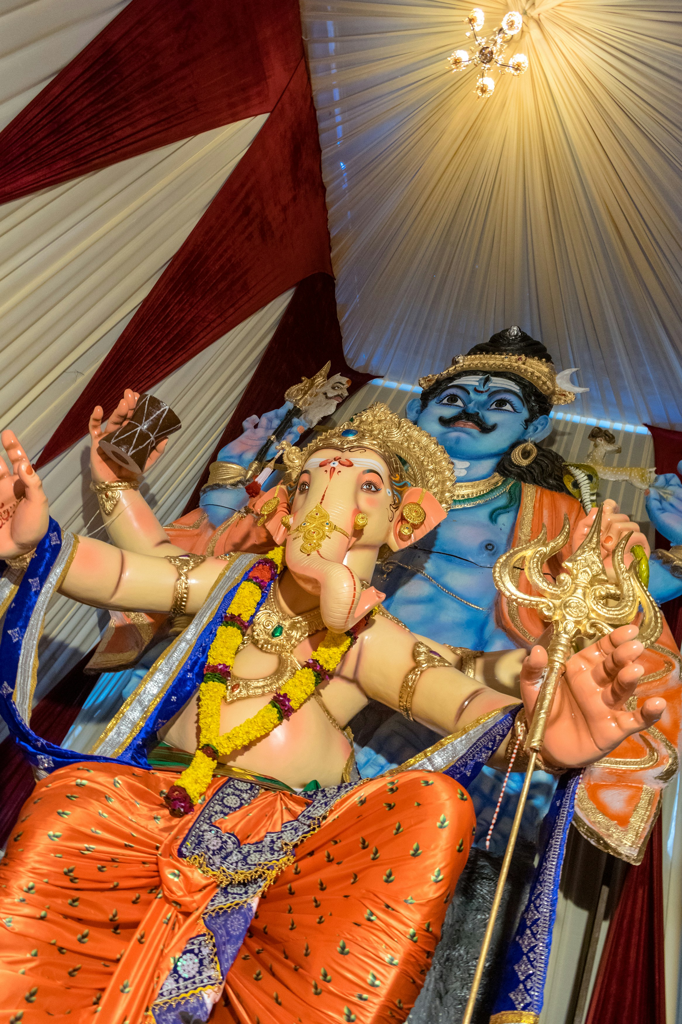 Ganesha idol with a blue deity behind him. photo – Free Ganesh Image on ...