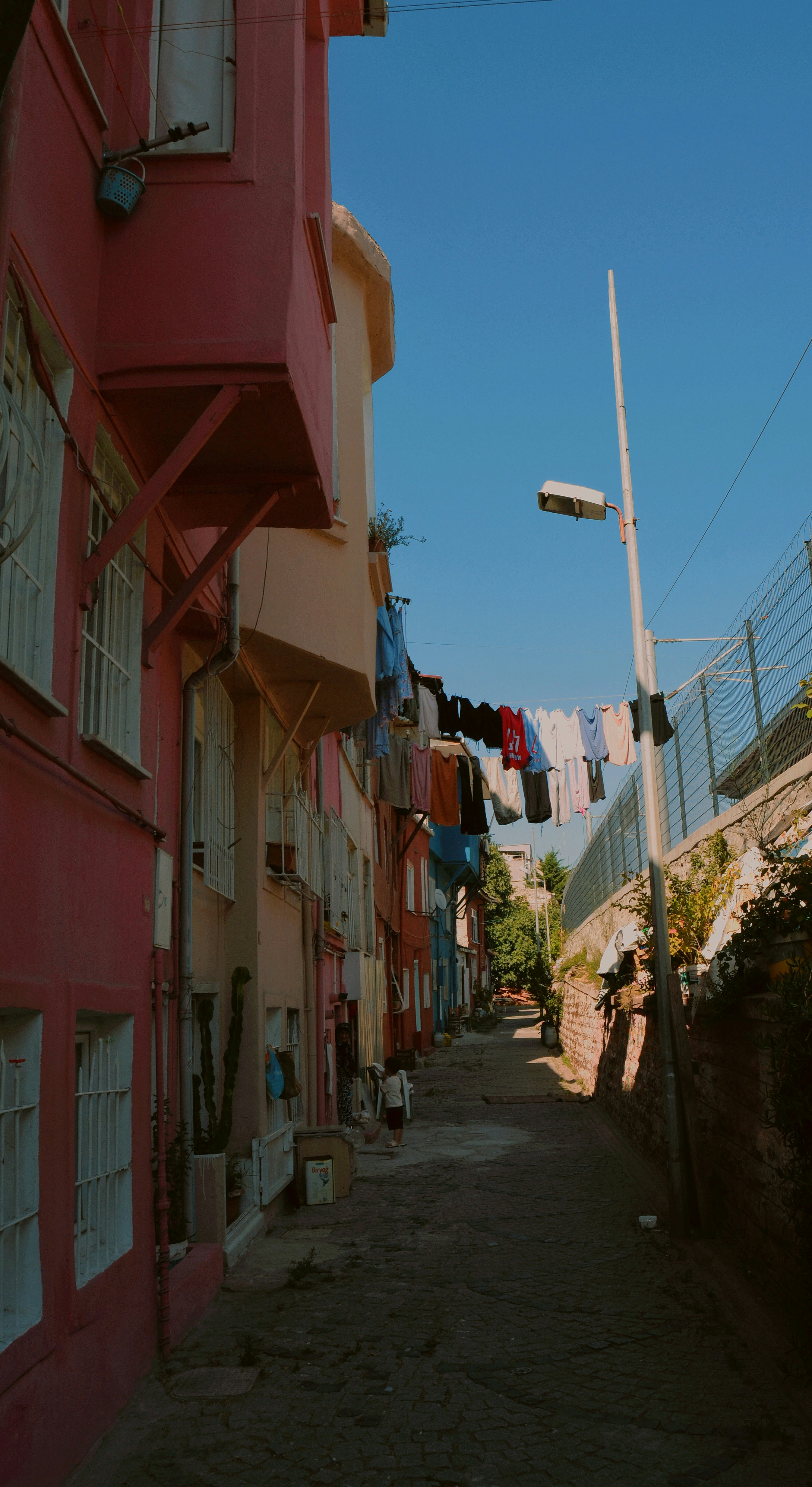 Clothes drying on a line in a narrow alley. photo – Free Summer Image ...