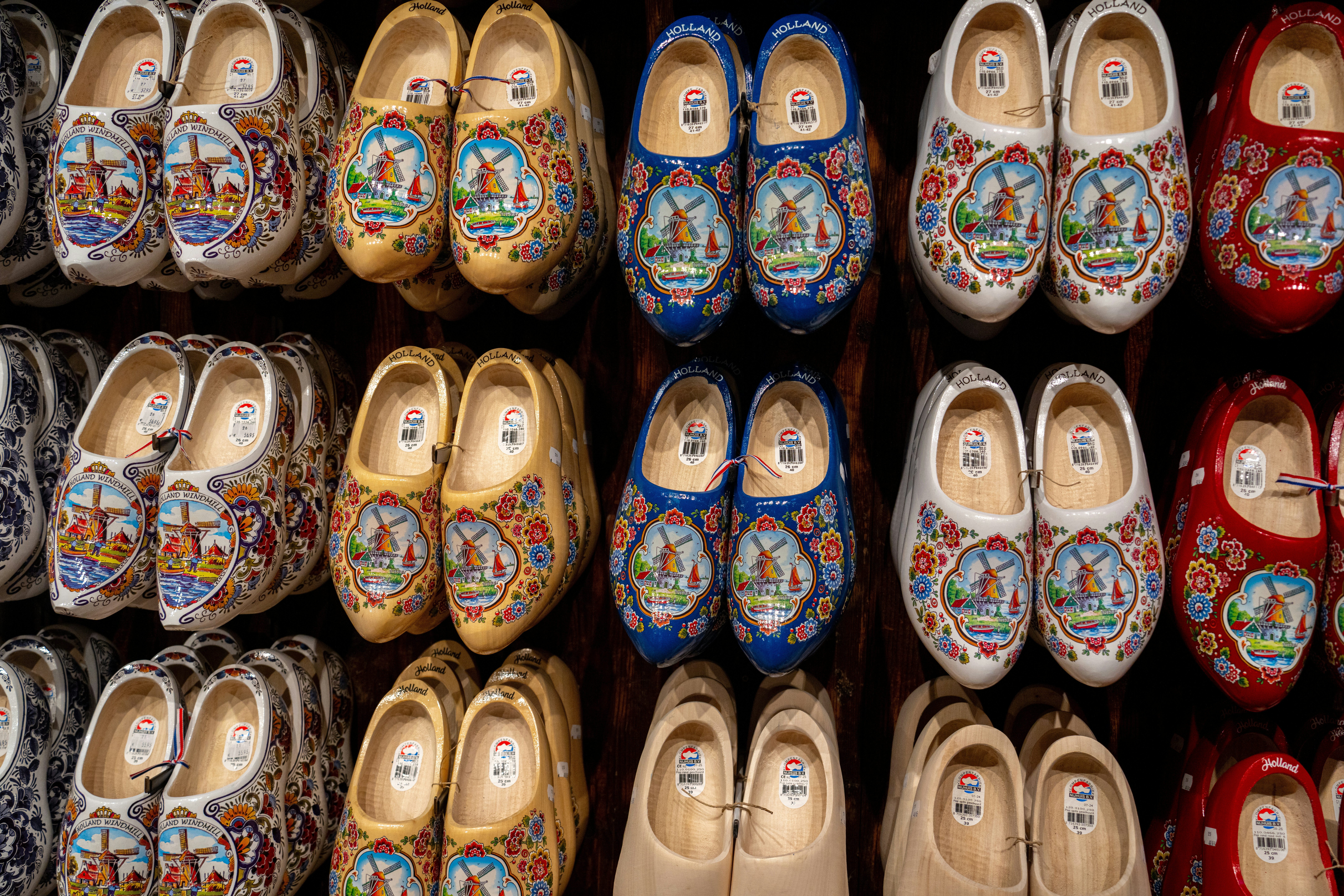 Rows of colorful, painted wooden dutch clogs displayed. photo – Free ...