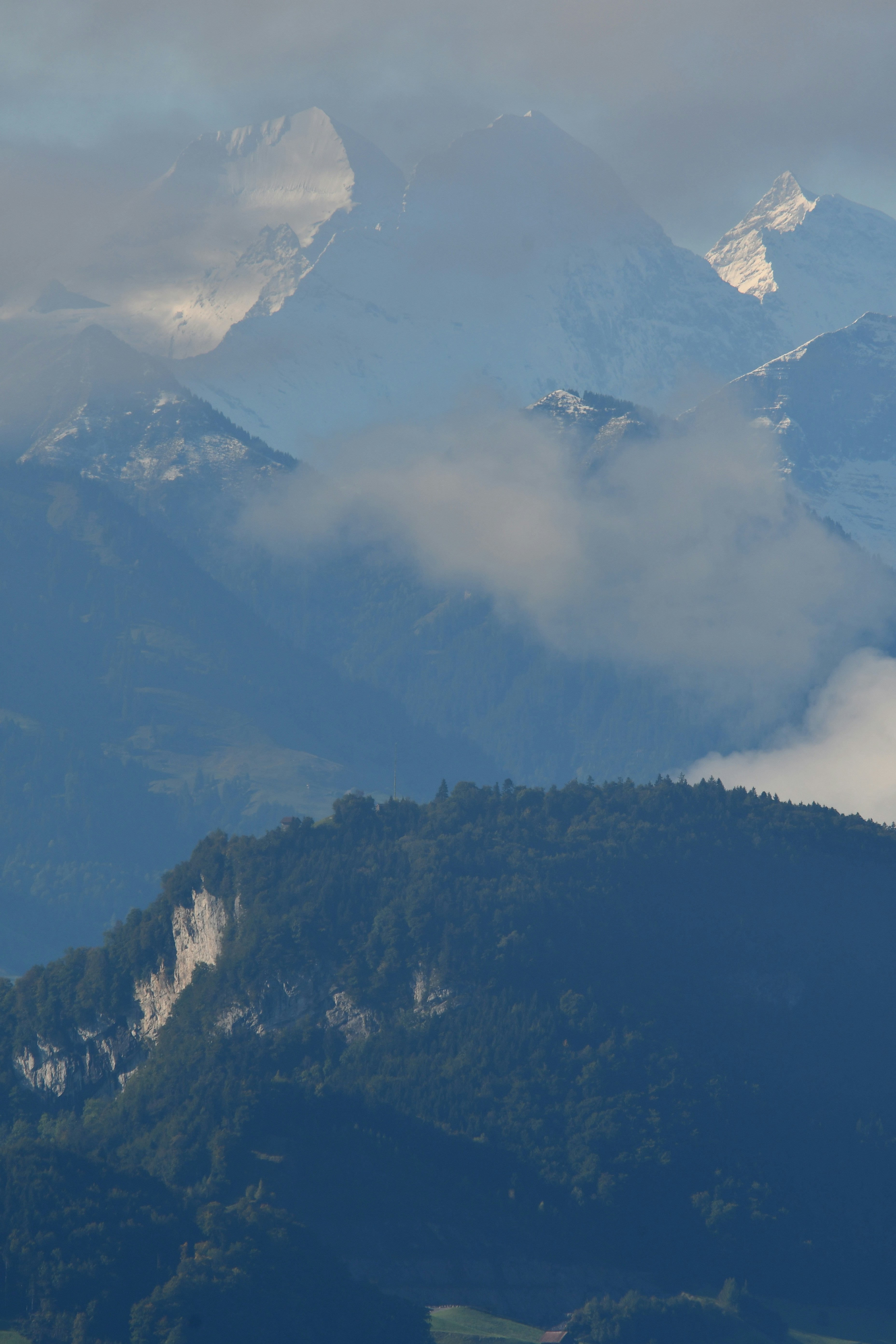 Veiled Peaks: A Symphony of Mountains and Mist