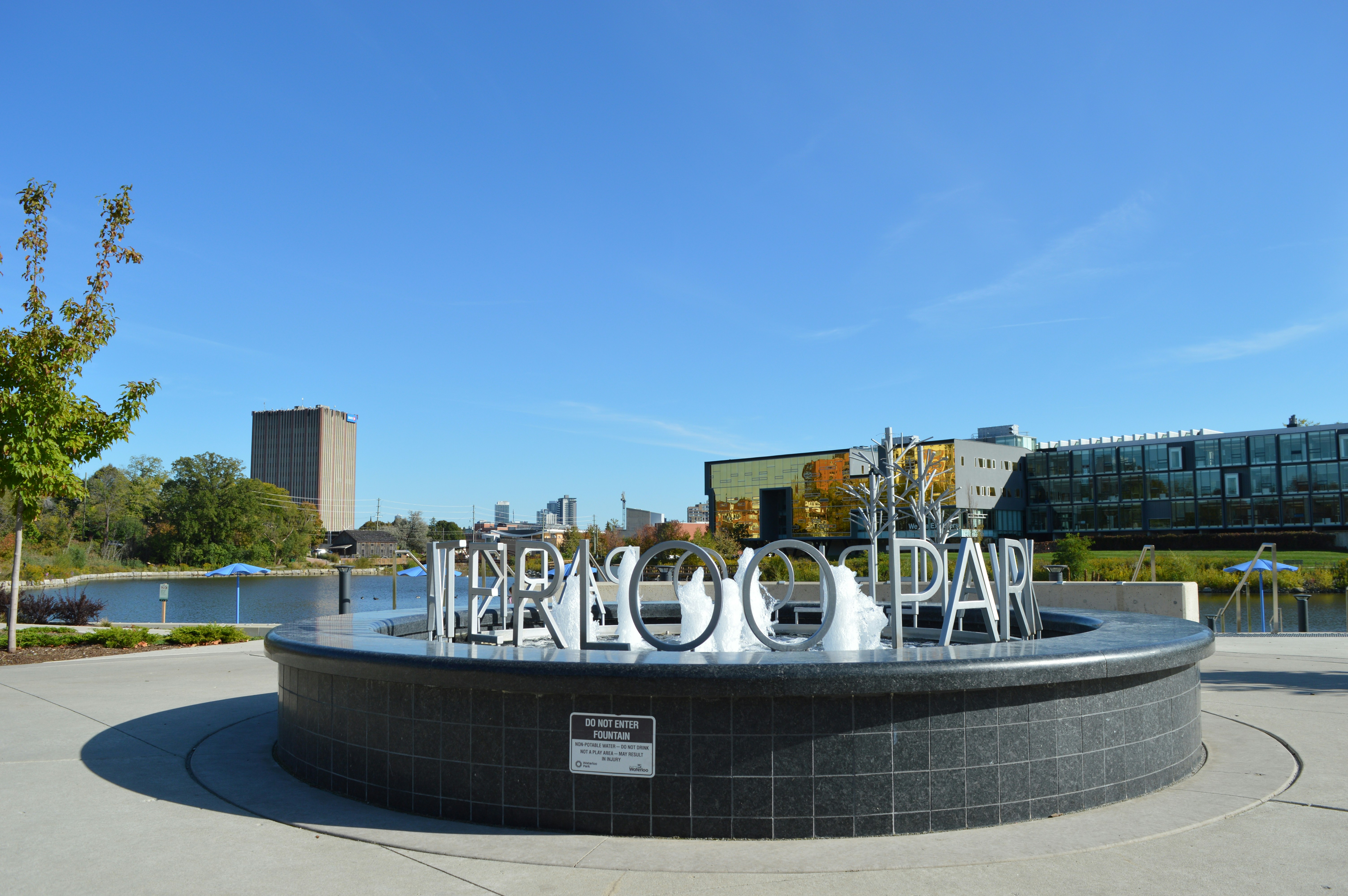 Public art "Waterloo Park" foundatin in front of Silver Lake in Waterloo Park, Ontario, Canada, with the Perimeter Institute and Marsland centre in the backdrop.