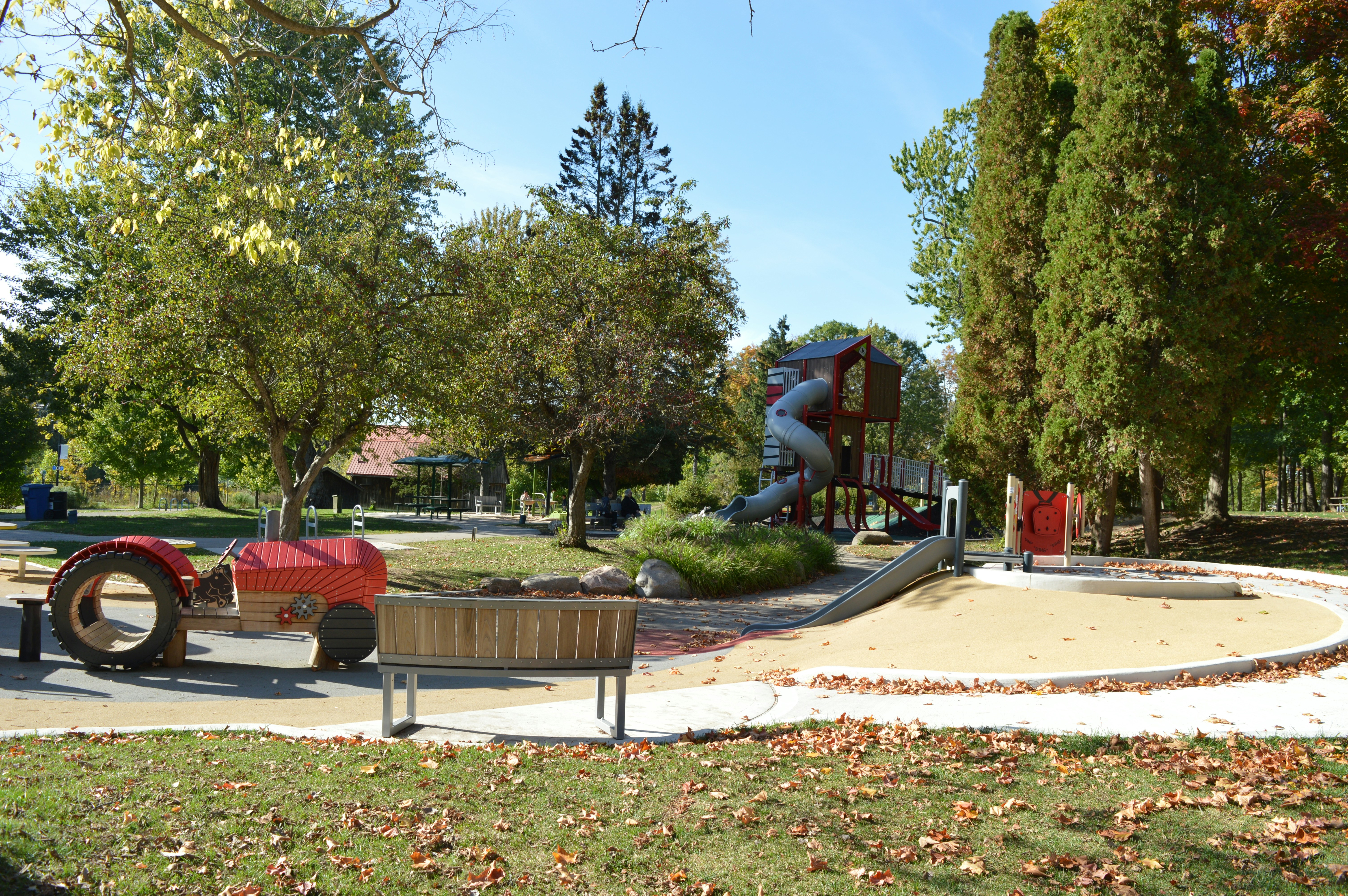 Playground in Waterloo Park, Ontario, Canada. | A sunny playground with slides and sandpit.