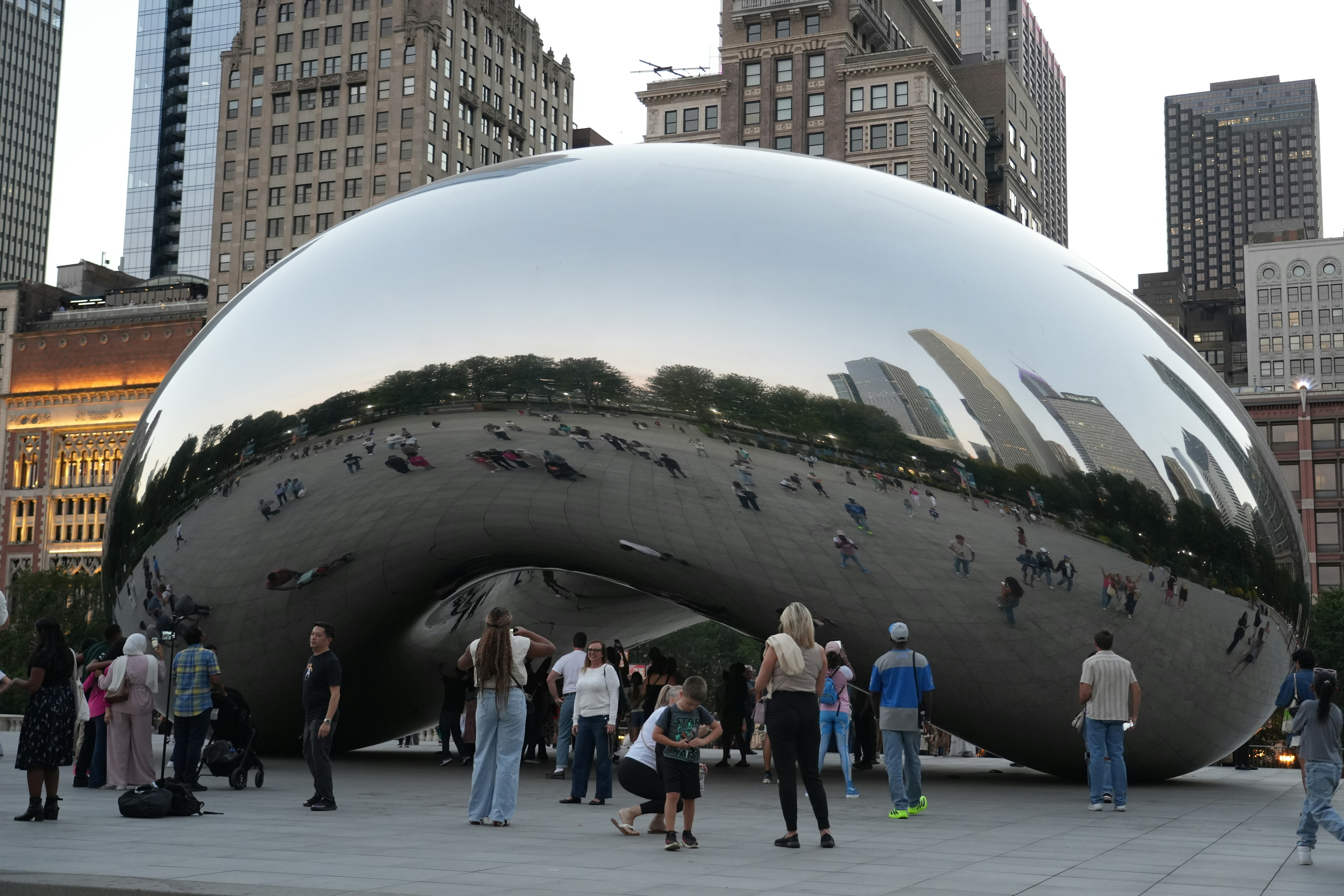 Reflections of Urban Life Beneath the Cloud Gate