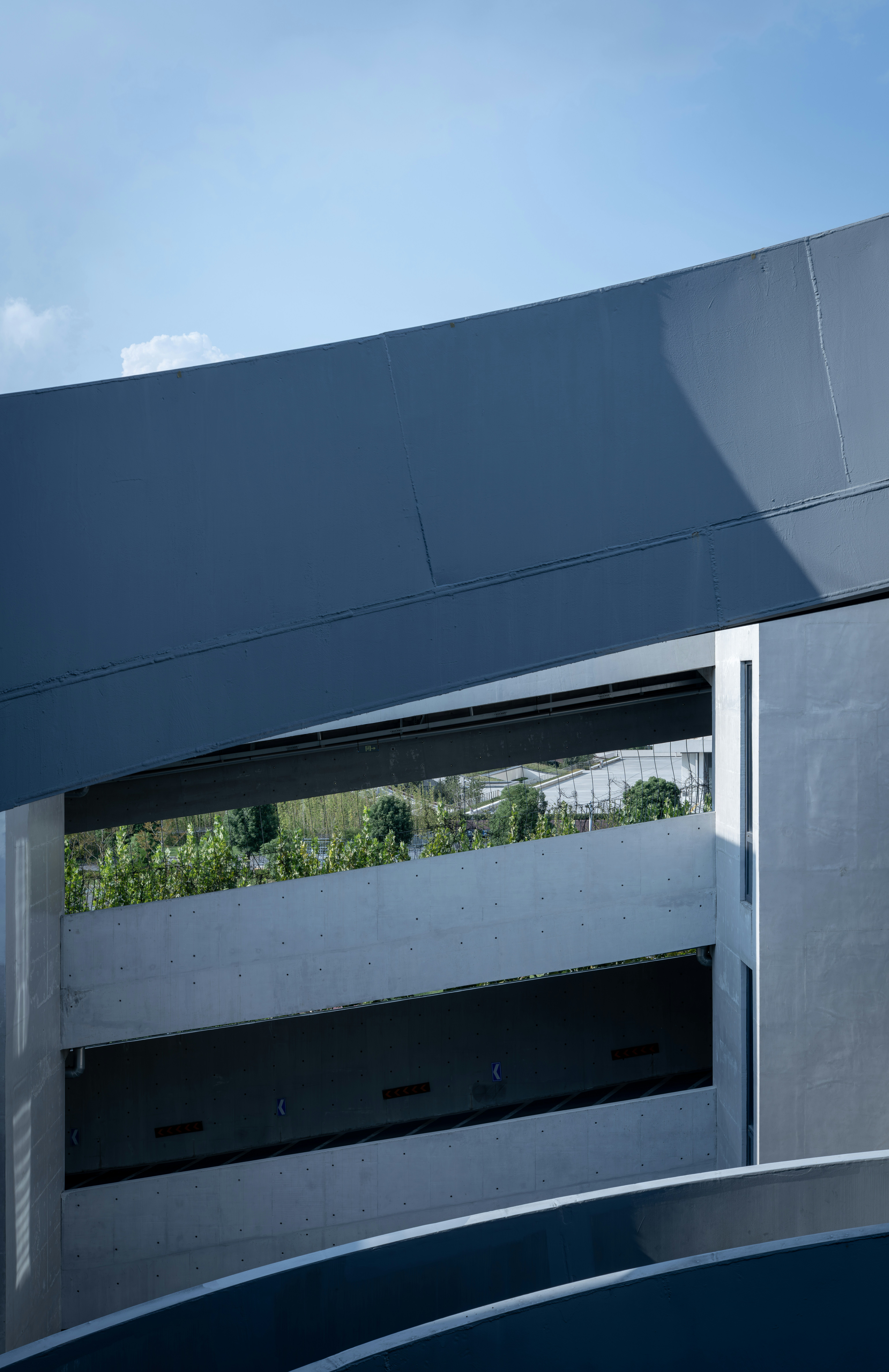 Blue Curtain and Concrete: Geometry Framing a Hidden Garden