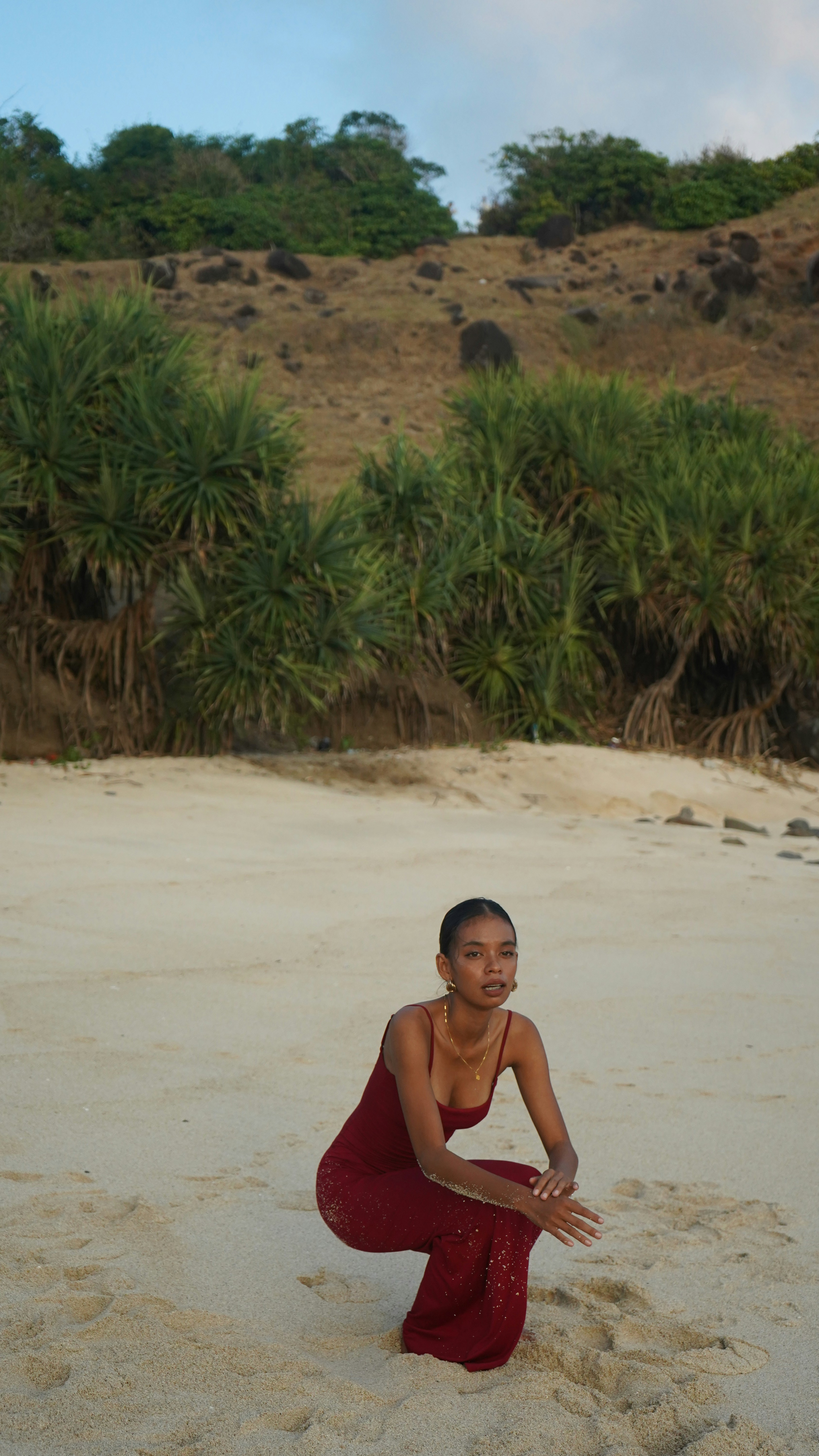 Crimson Draped Poise by a Quiet Shore