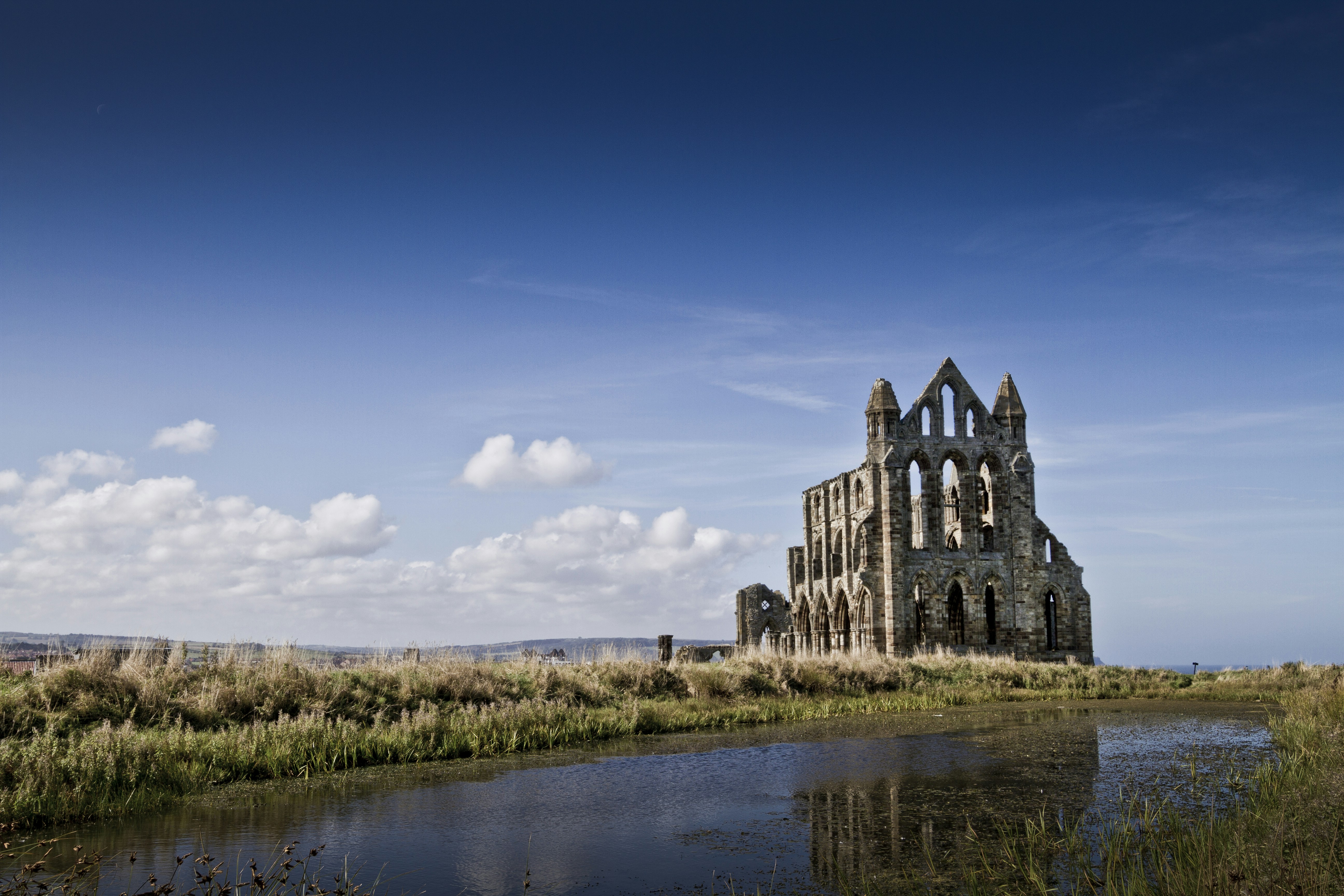 Michael Beckwith www.beckwithphotography.com | Ruined abbey on a hill overlooking water