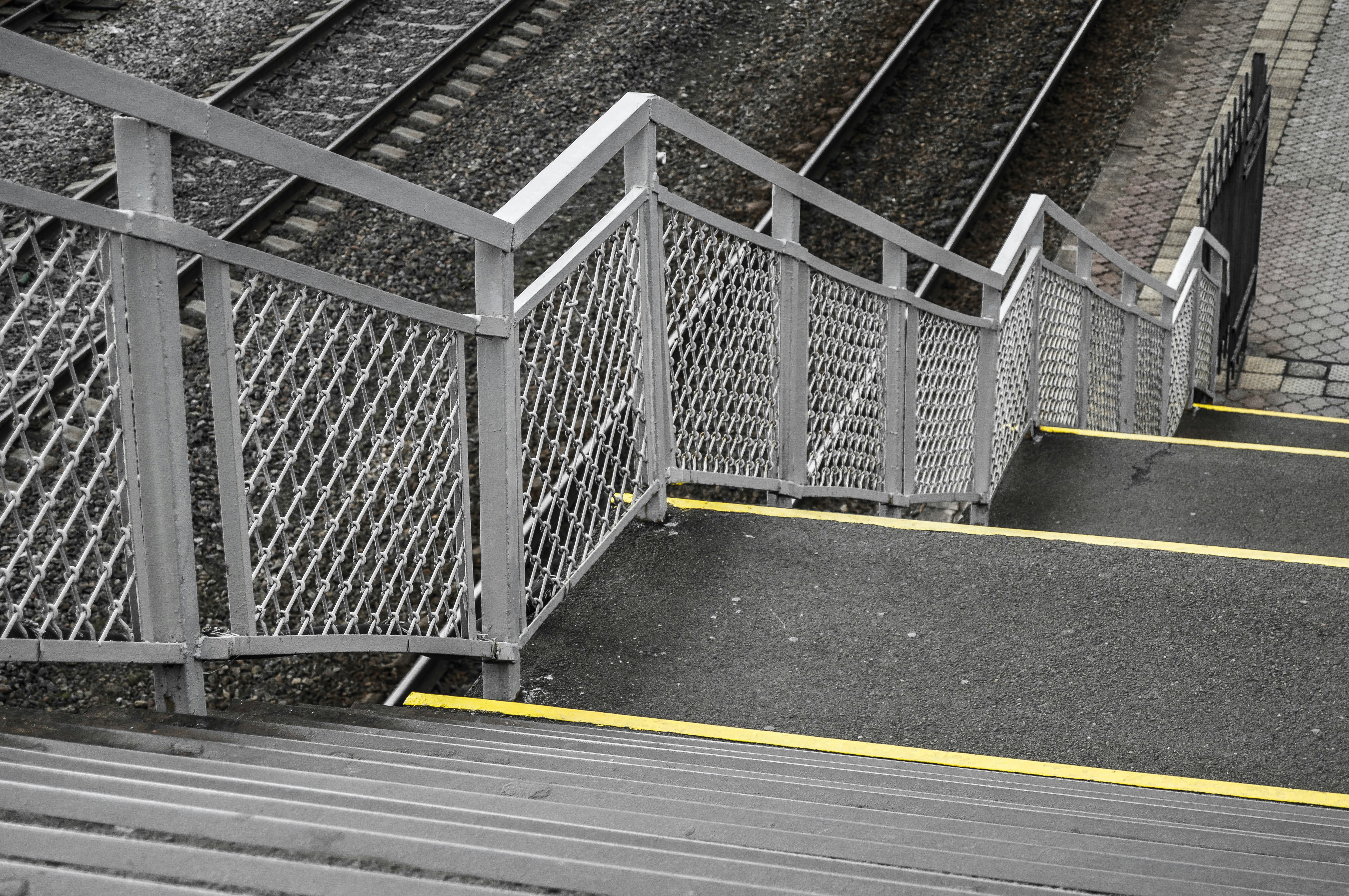 starway | Stairs with metal railing beside train tracks