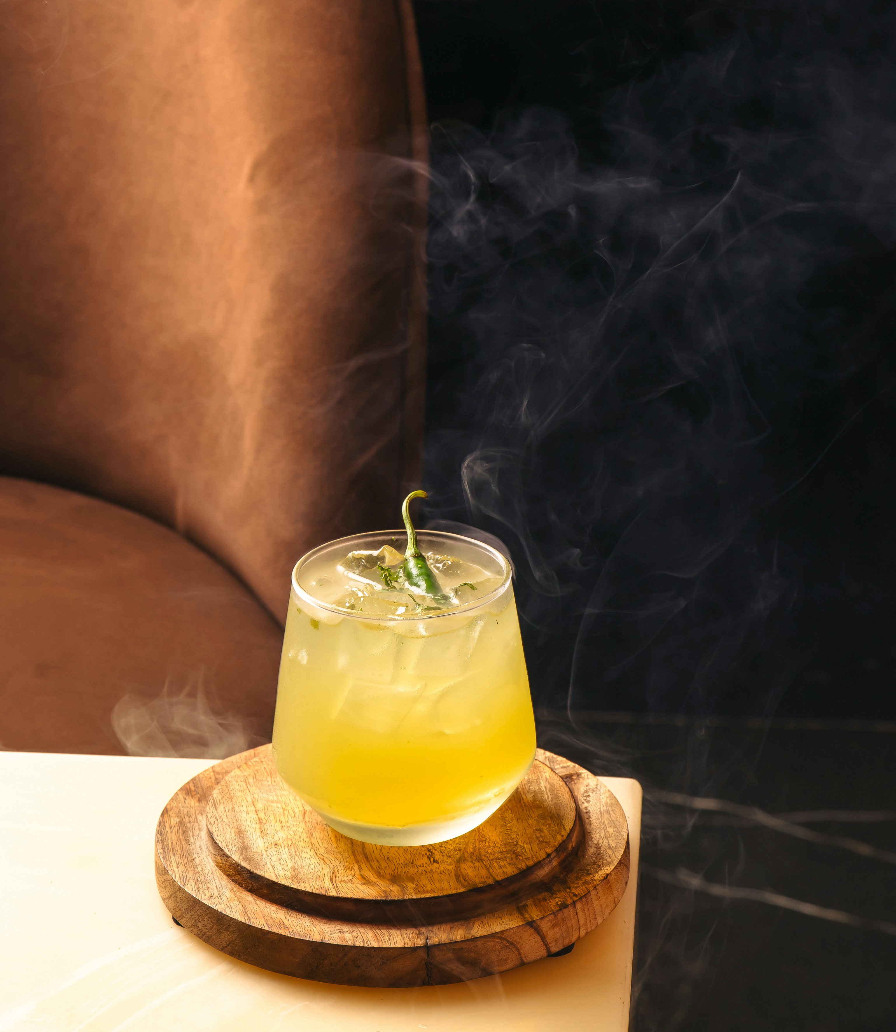 Drink shoot | A refreshing yellow cocktail with ice and garnish.