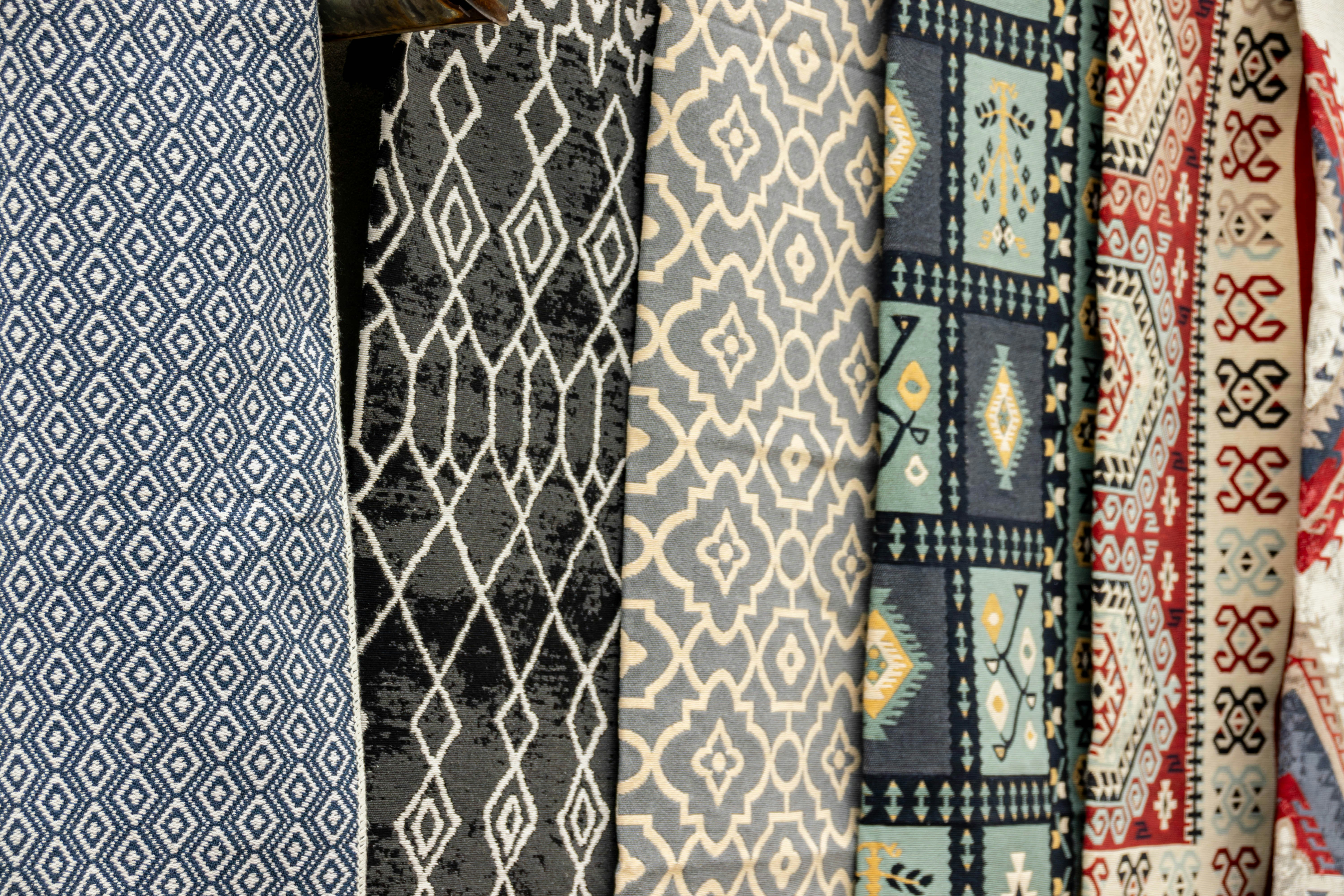 Carpet | Various patterned rugs displayed side-by-side.