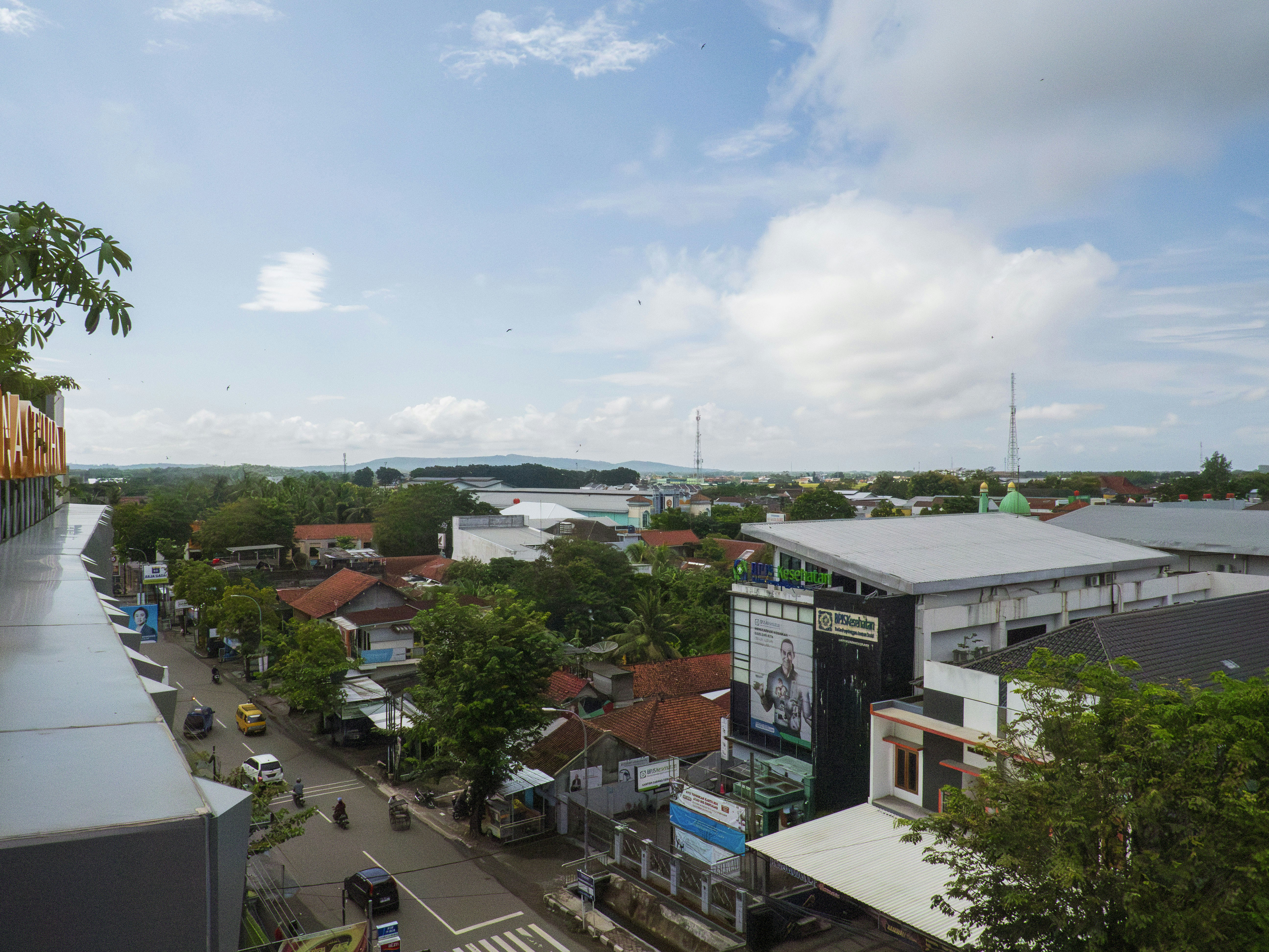 Billboard Spotlight: A Rooftop View Over a Sunlit Town