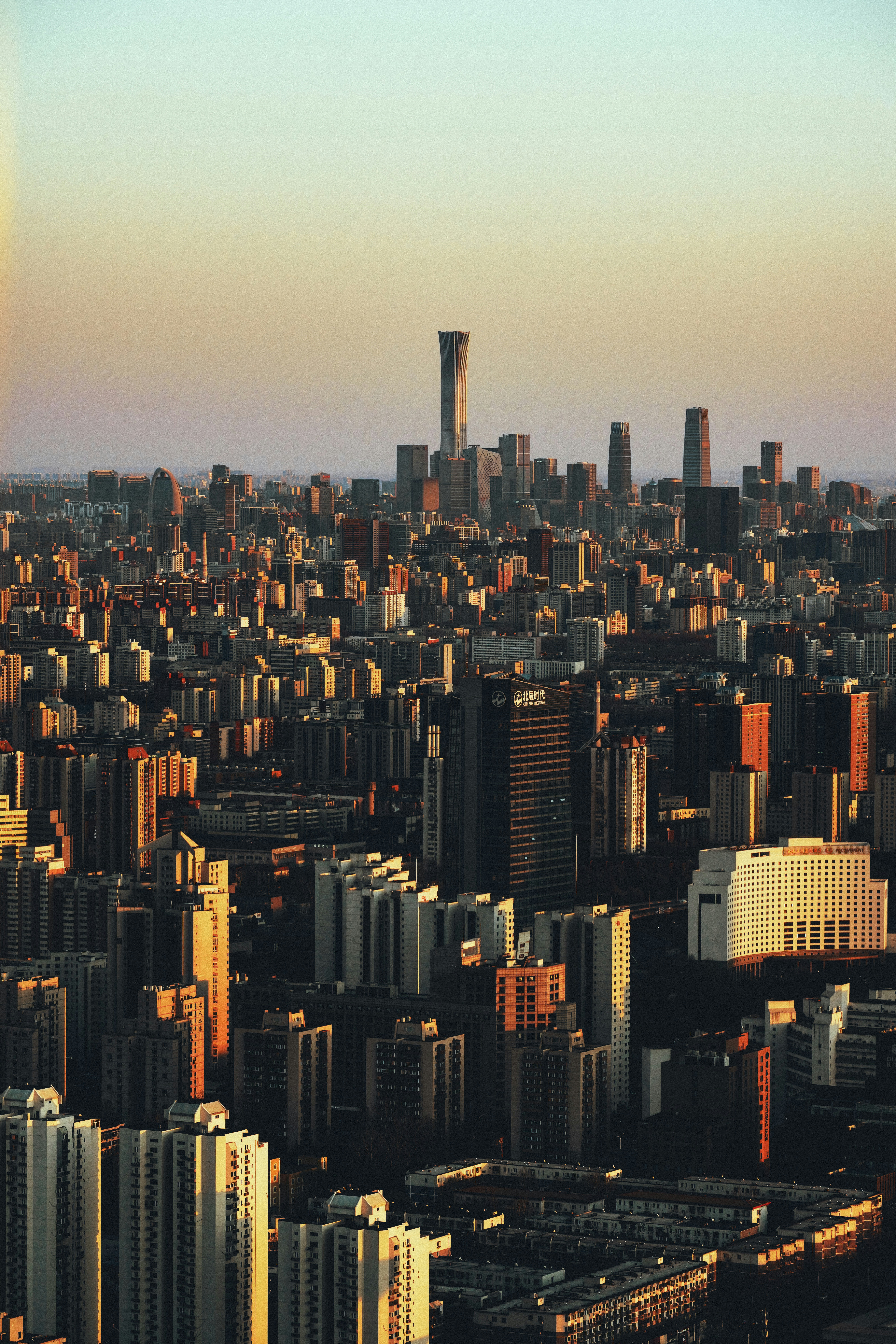 Skyscrapers in a dense city at sunset