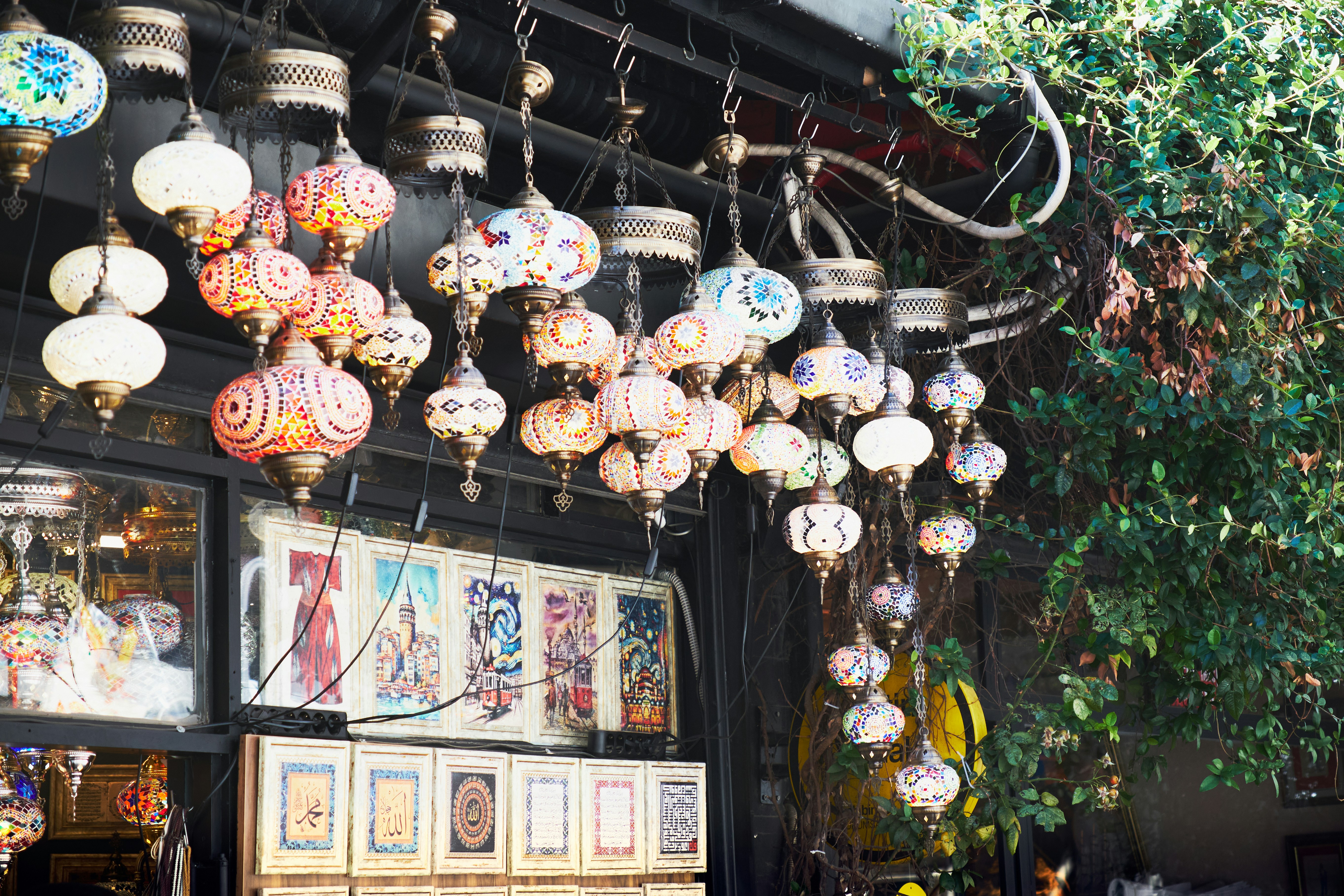 Colorful mosaic lamps hanging outside a shop