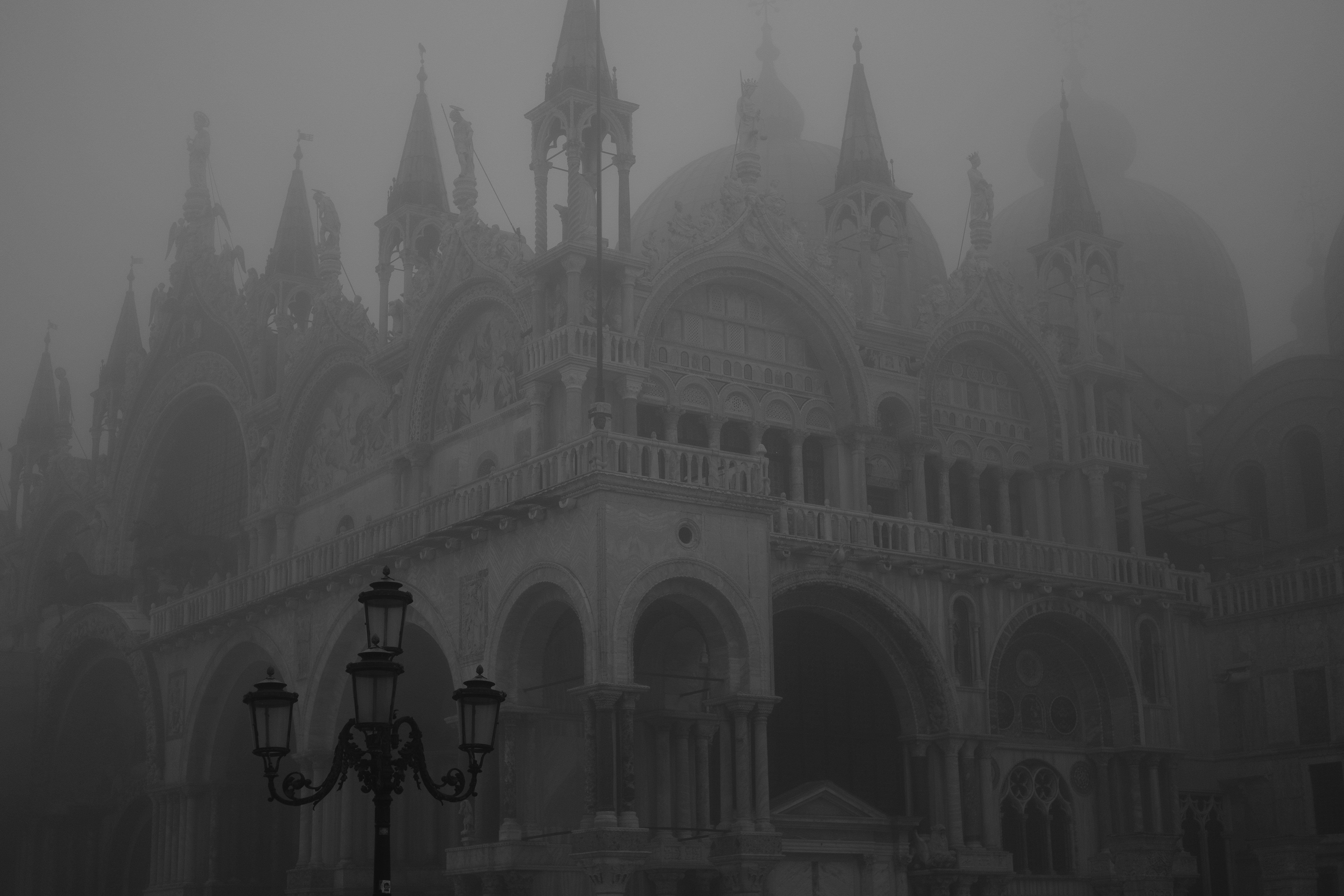 Ornate building shrouded in thick fog