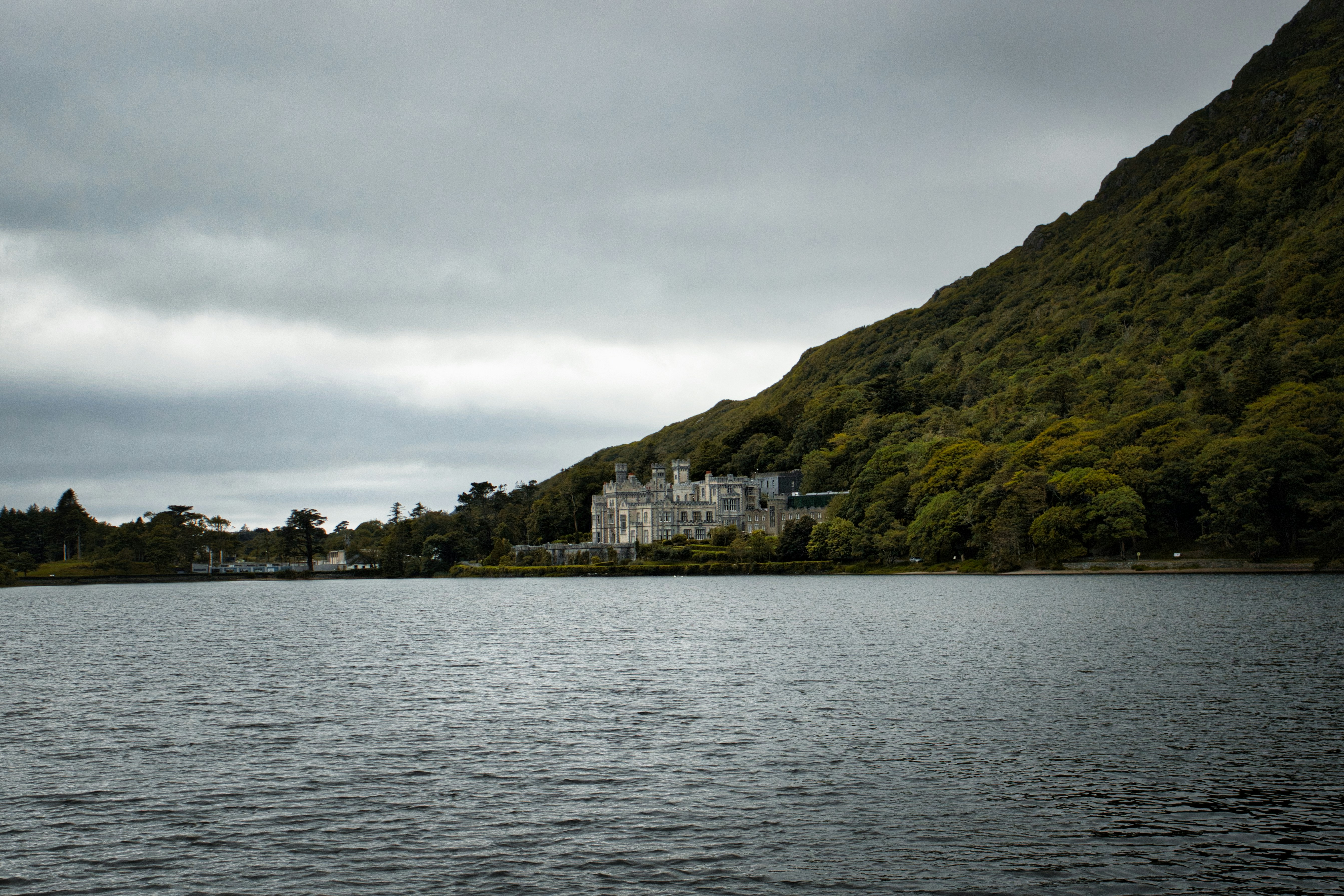 Lakeside Manor Framed by a Verdant Hill