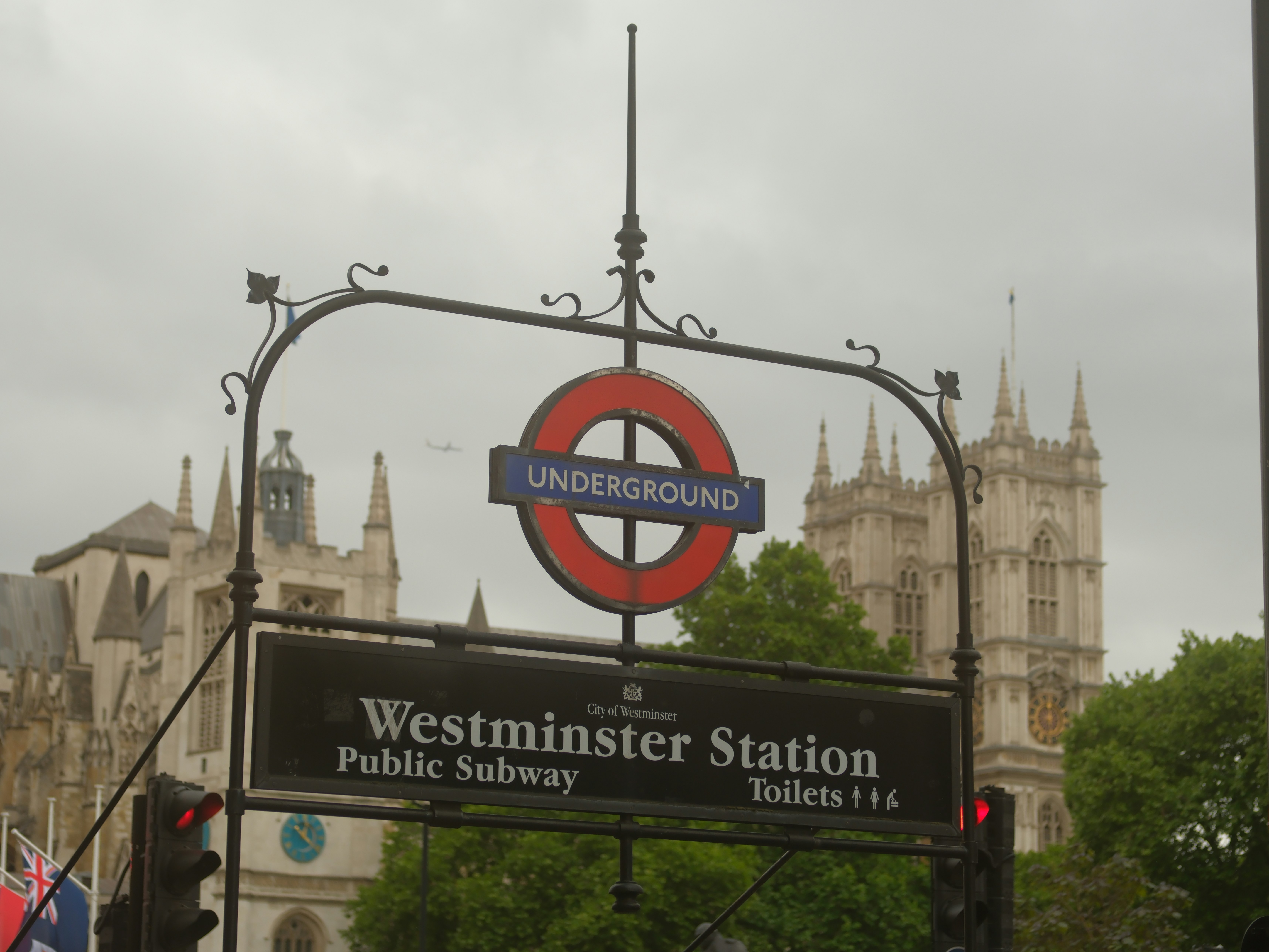 Westminster station sign with building in background