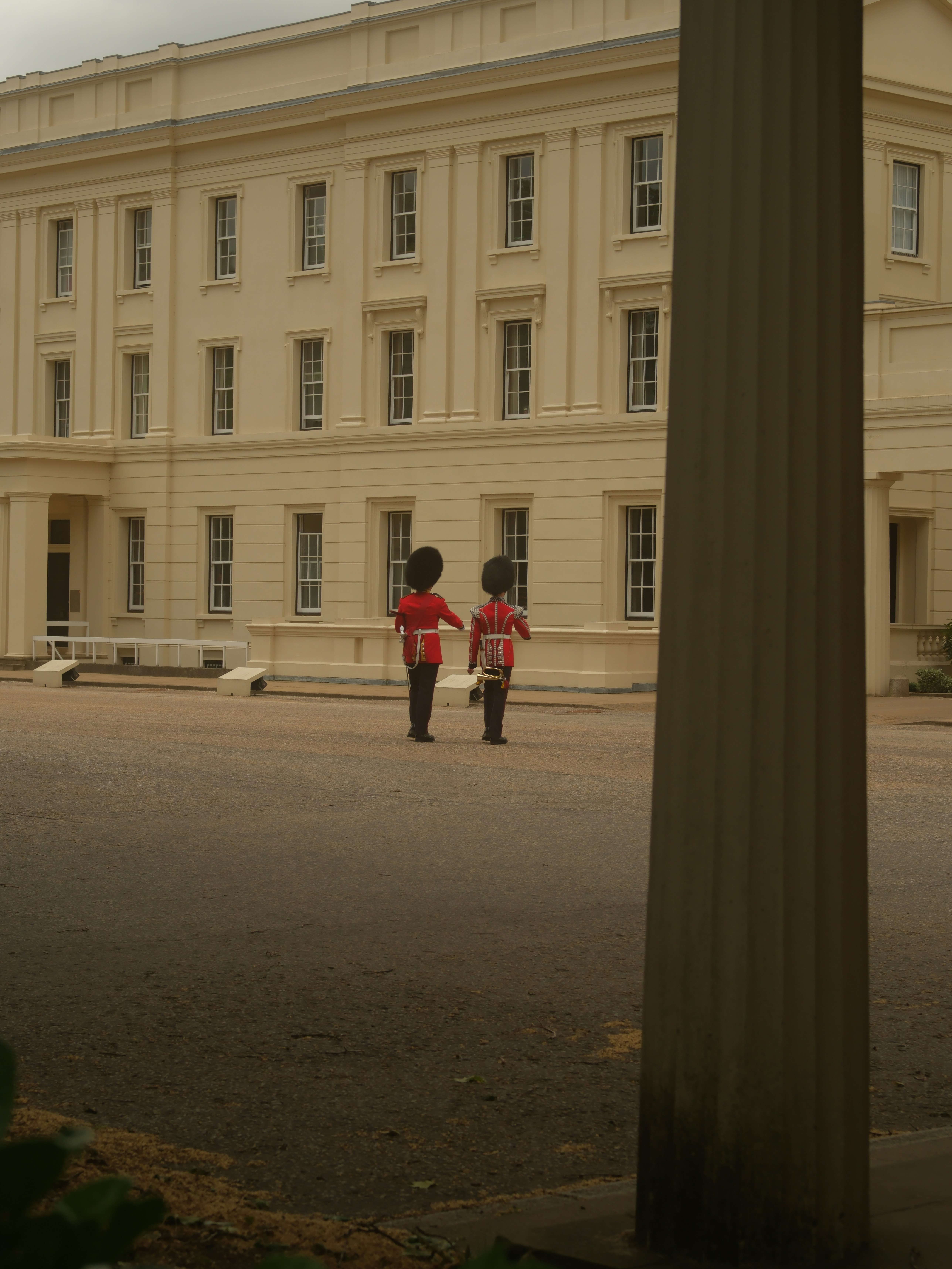 Two guards in uniform walk near a building. photo – Free Architecture ...