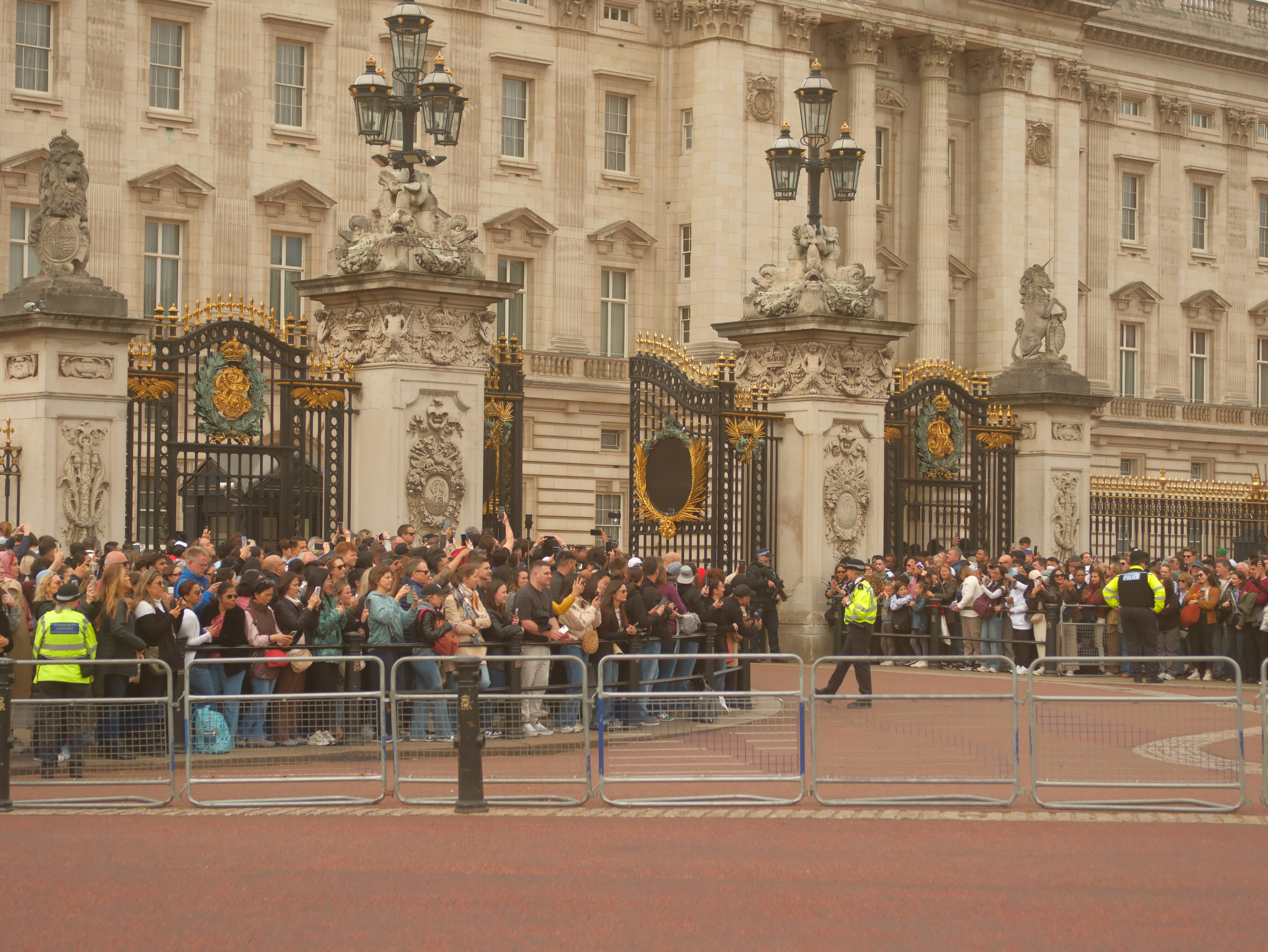 Crowd gathered outside Buckingham Palace, showcasing a moment of public engagement with royal heritage.