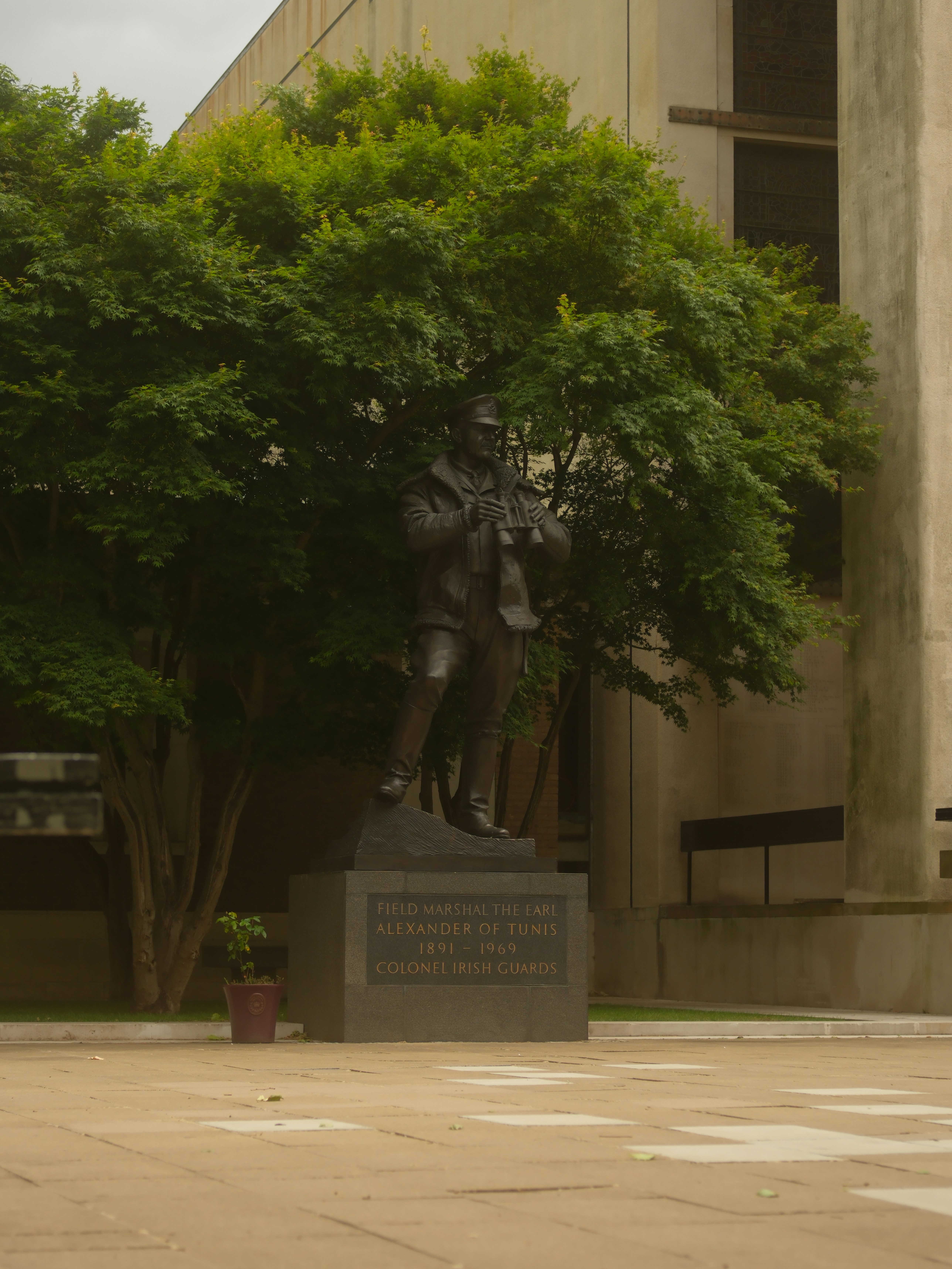 Statue of a man in front of a building