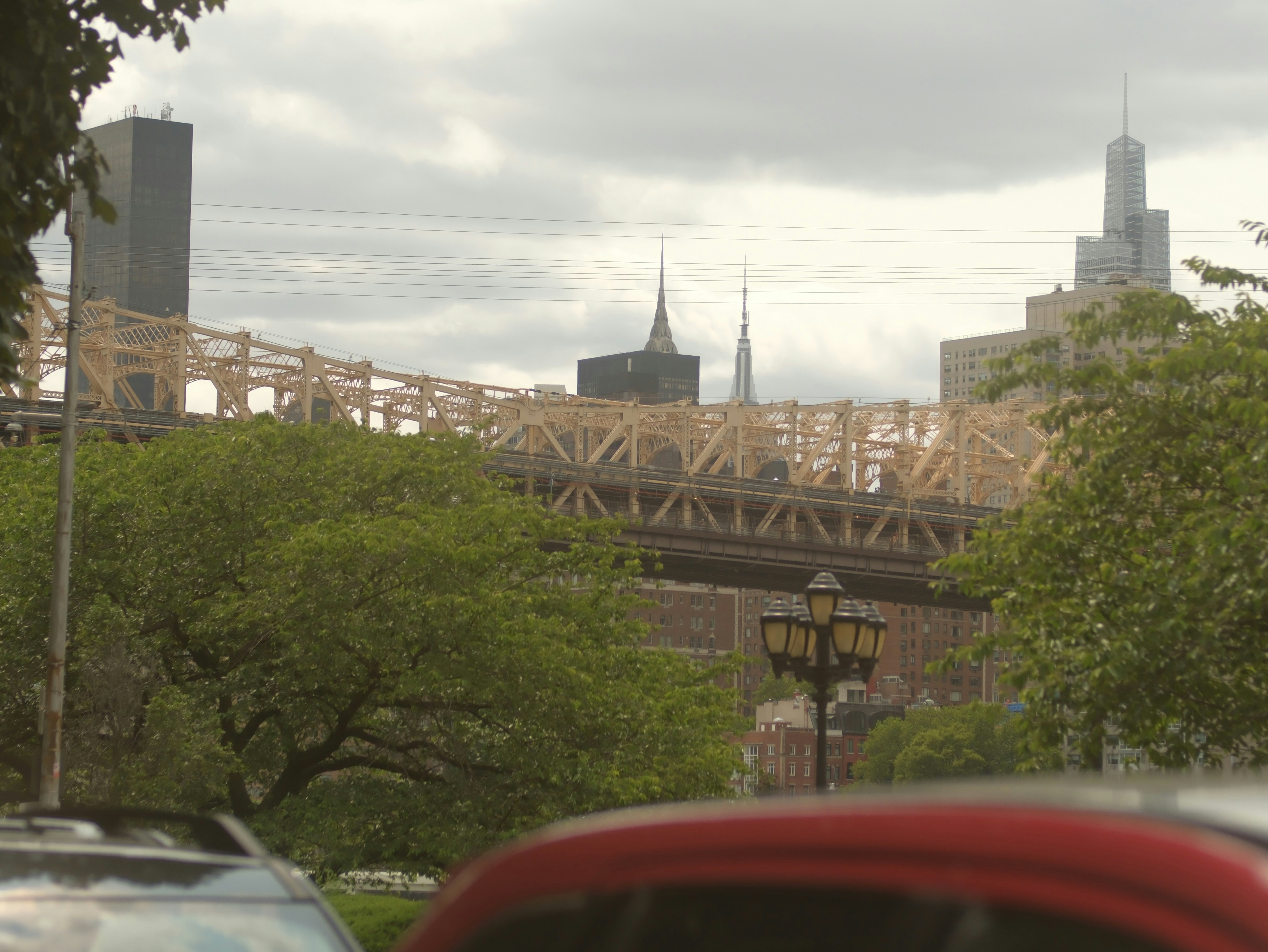 Wooden bridge with city skyline in background