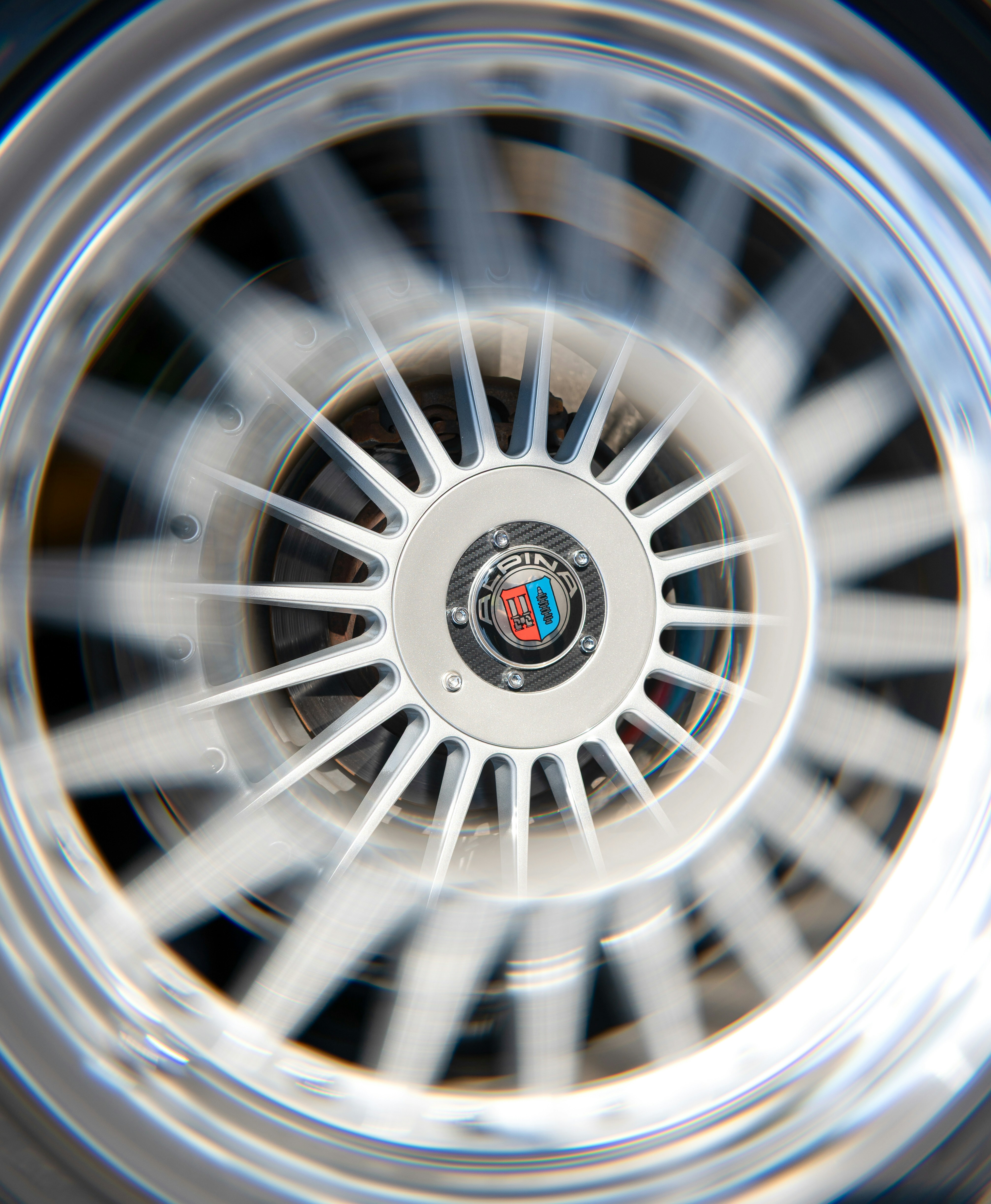Spinning car wheel with motion blur