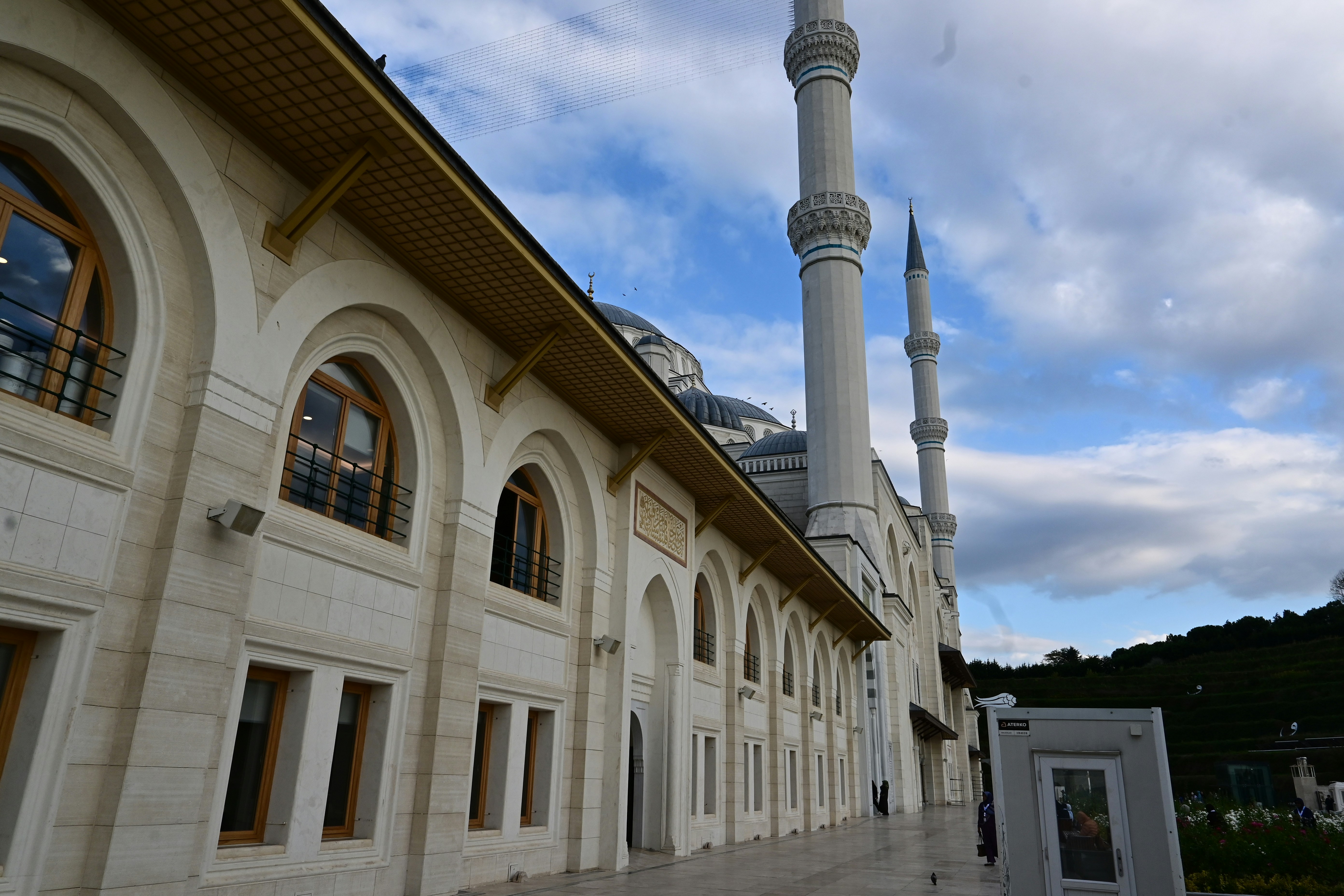 Büyük Çamlıca Camii - The Great Camlica Mosque | Large white mosque with tall minarets under cloudy sky