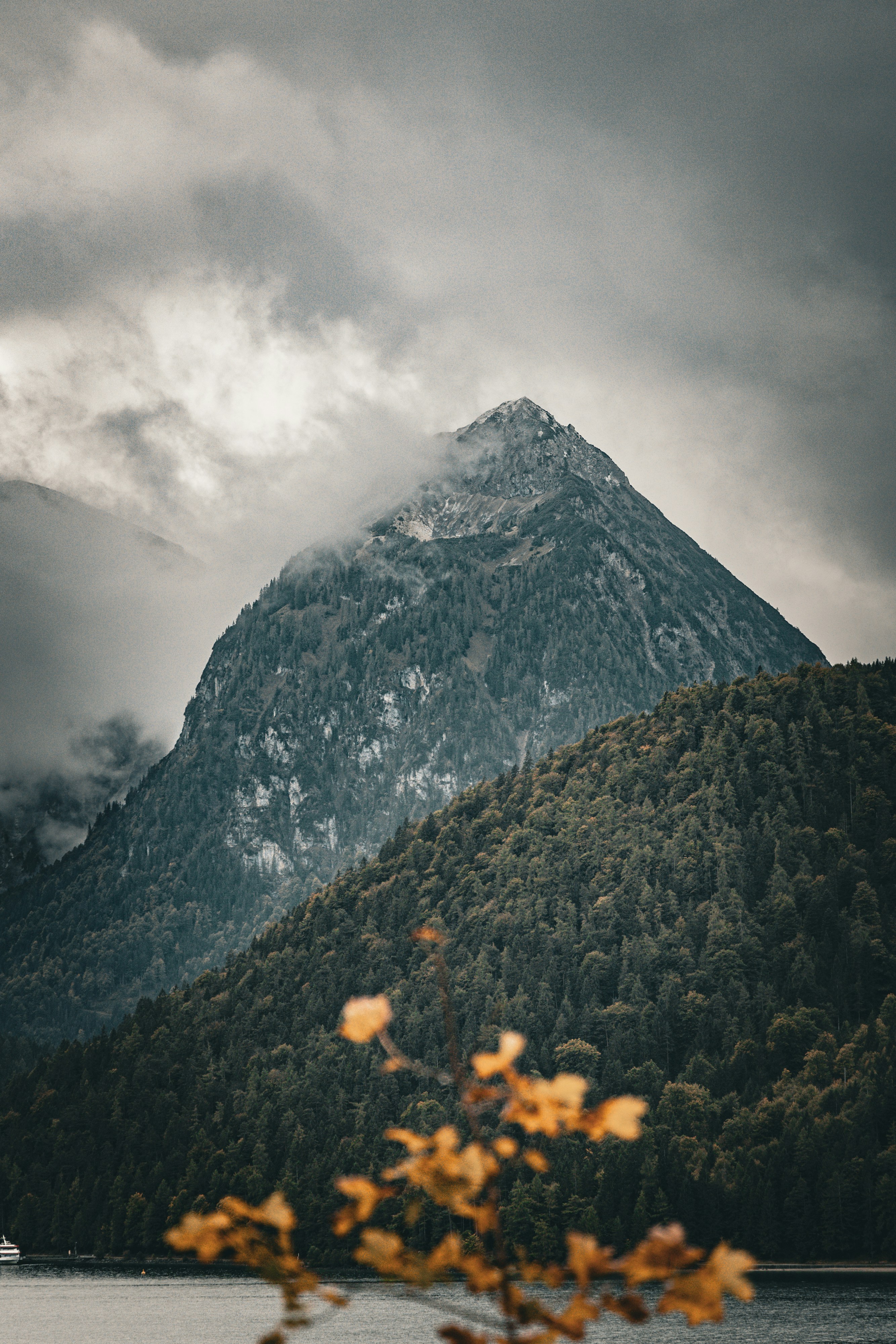 A majestic mountain peak shrouded in clouds.