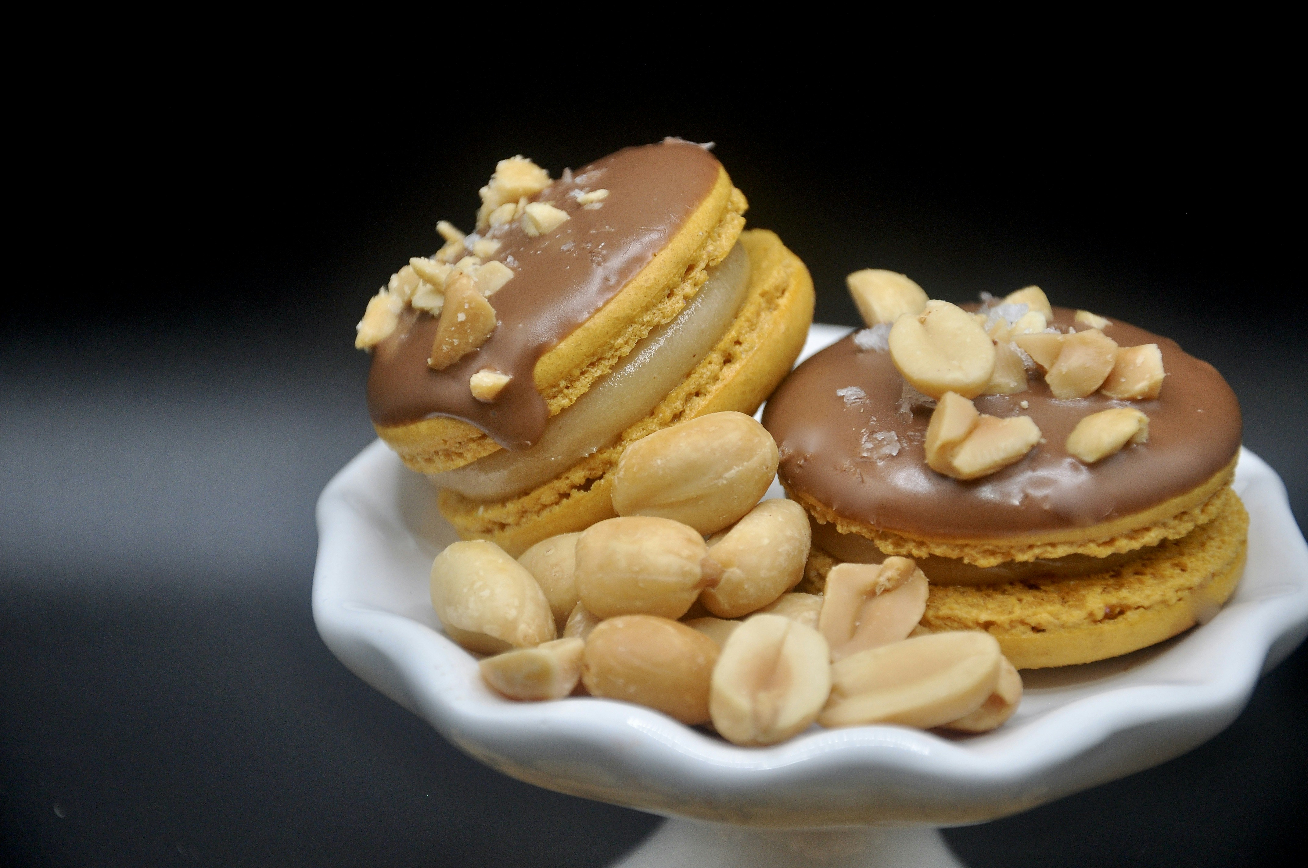Two peanut macarons with chocolate and nuts photo – Free Food Image on ...
