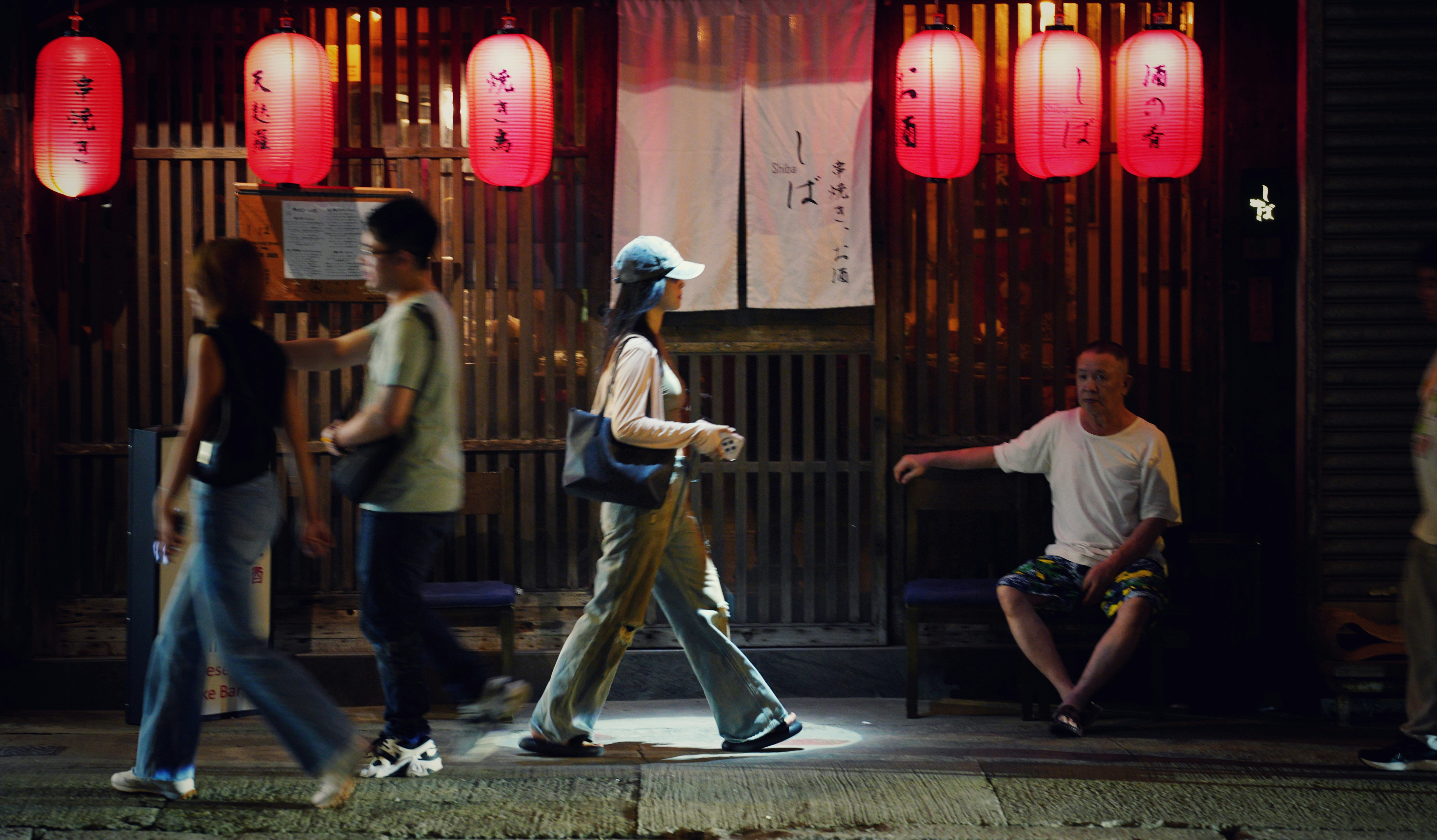 Midnight Lantern Walk: A Neon-lit Street Scene in Motion