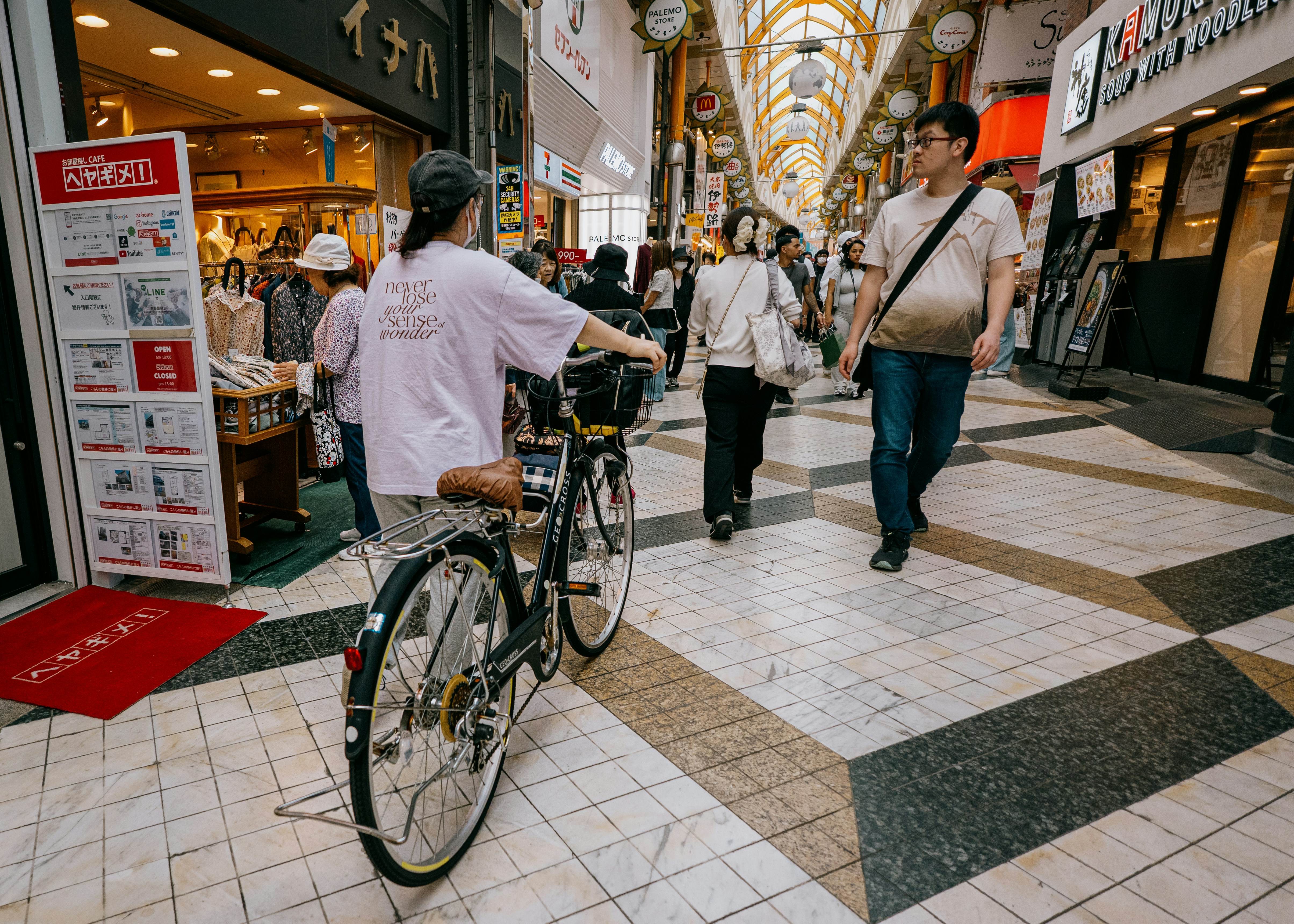 Pedals in the Passage: A Bicycle Anchors a Busy Arcade