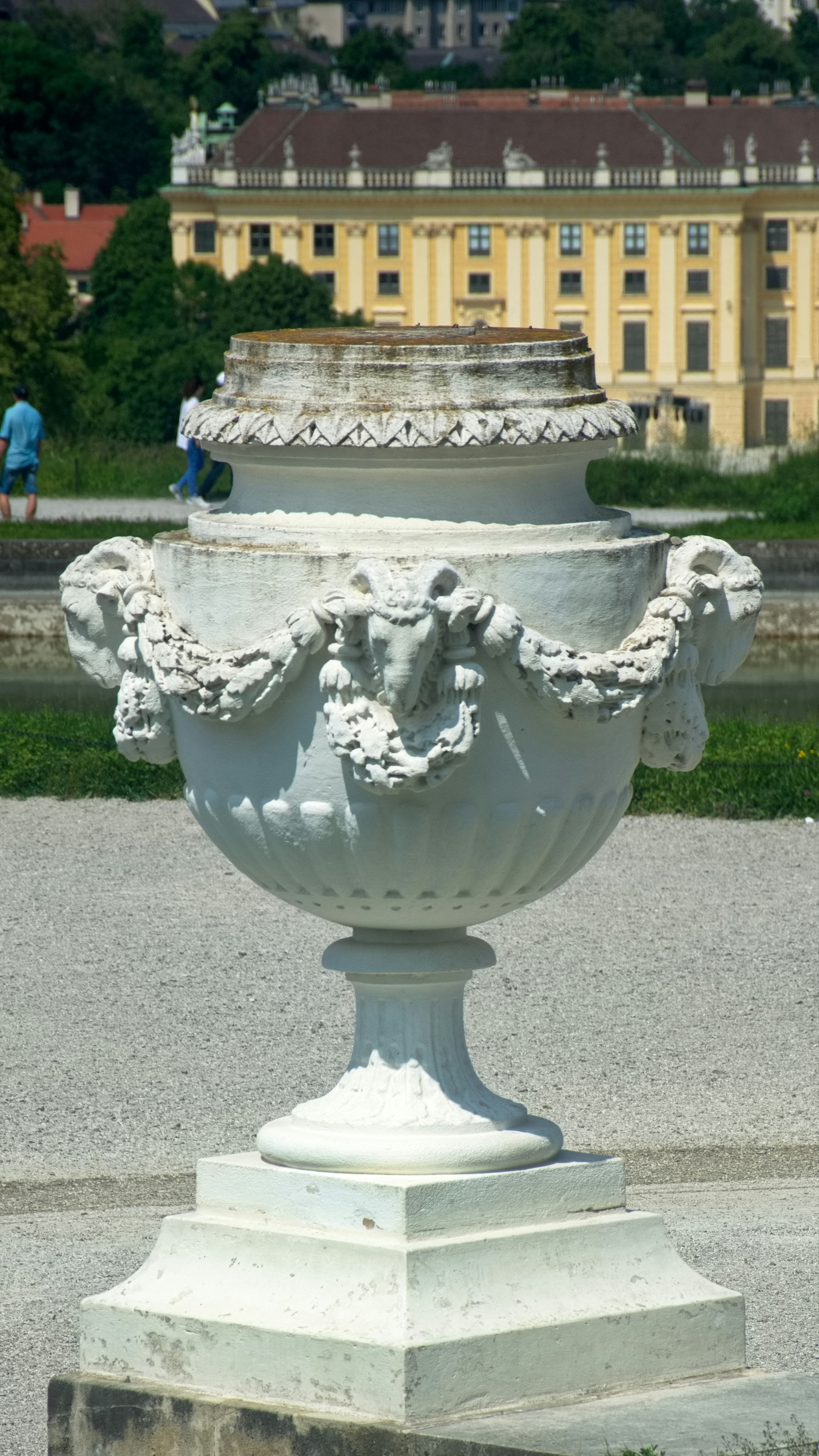 Elegance in Stone: A Garden's Sentinel