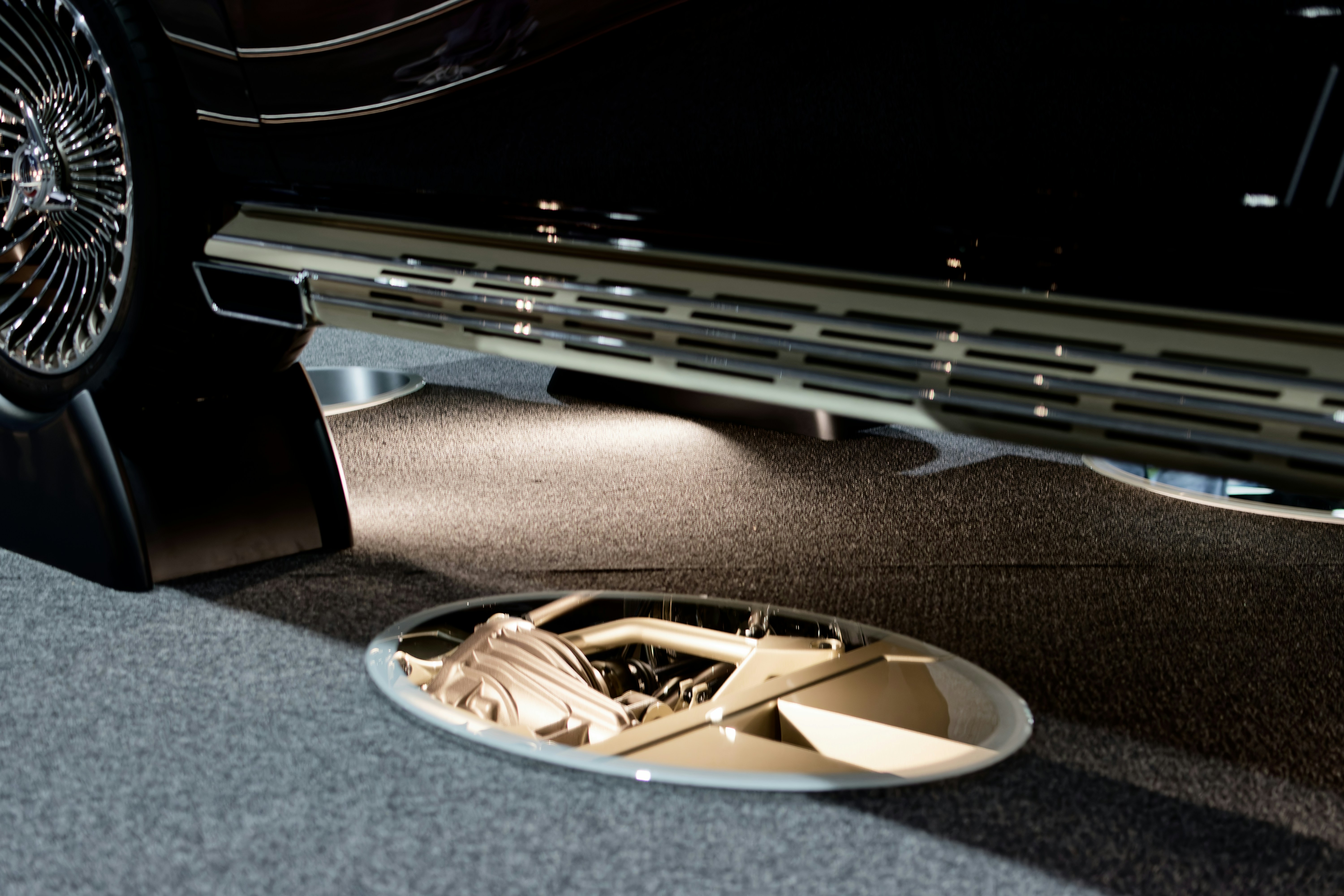 1967 Ford Mustang Fastback GT Restomod — custom show build in metallic blue, Oregon Car Expo 2025 | Close-up of a shiny chrome exhaust pipe on a car.
