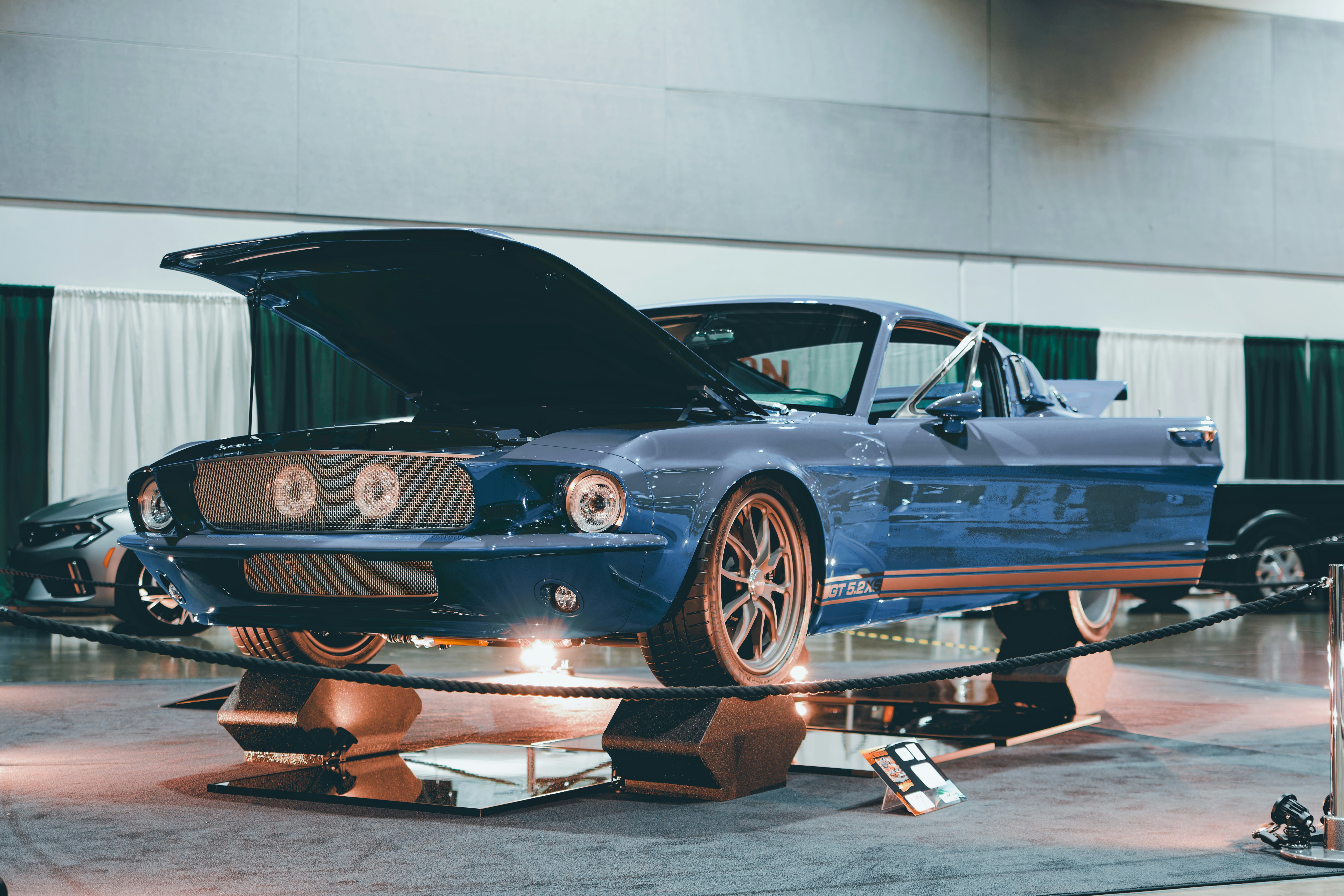 1967 Ford Mustang Fastback GT Restomod — custom show build in metallic blue, Oregon Car Expo 2025 | Blue vintage car with hood open on display