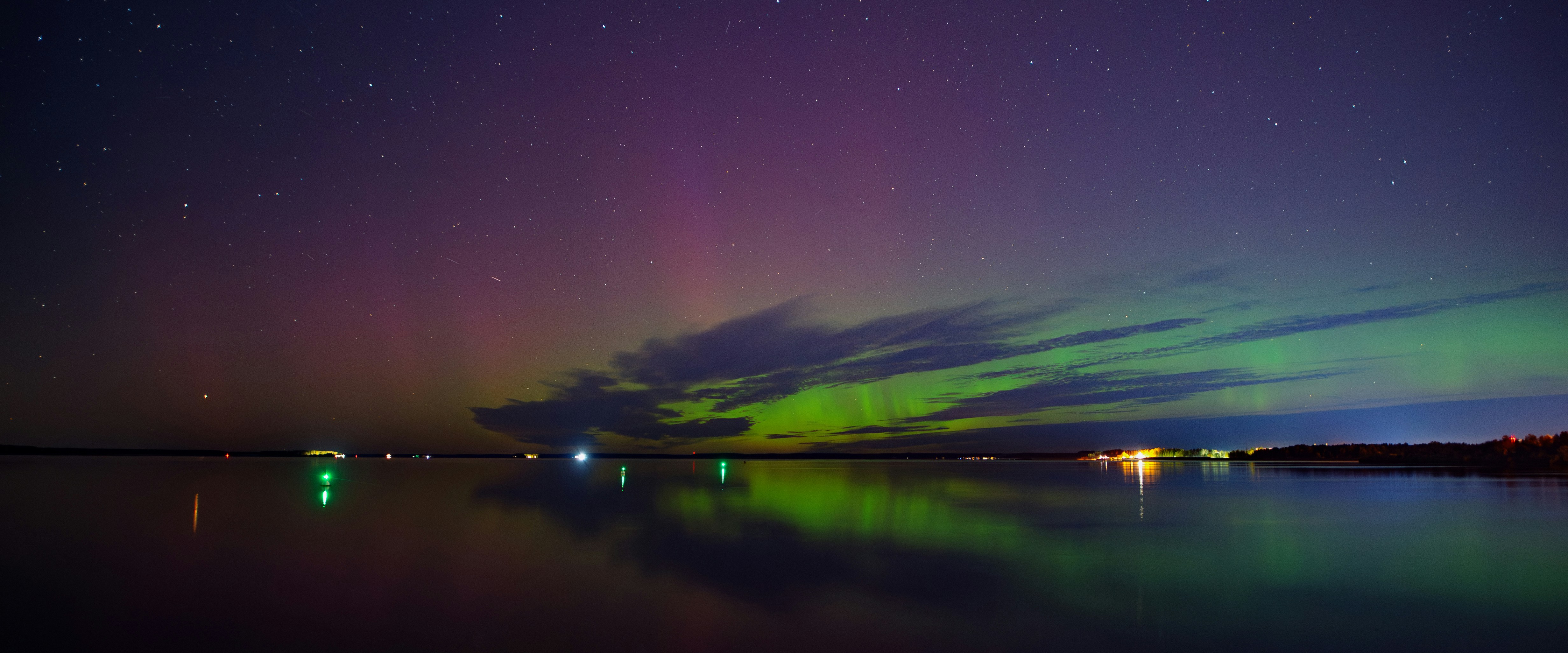 Celestial Symphony: A Dance of Colors Above the Water