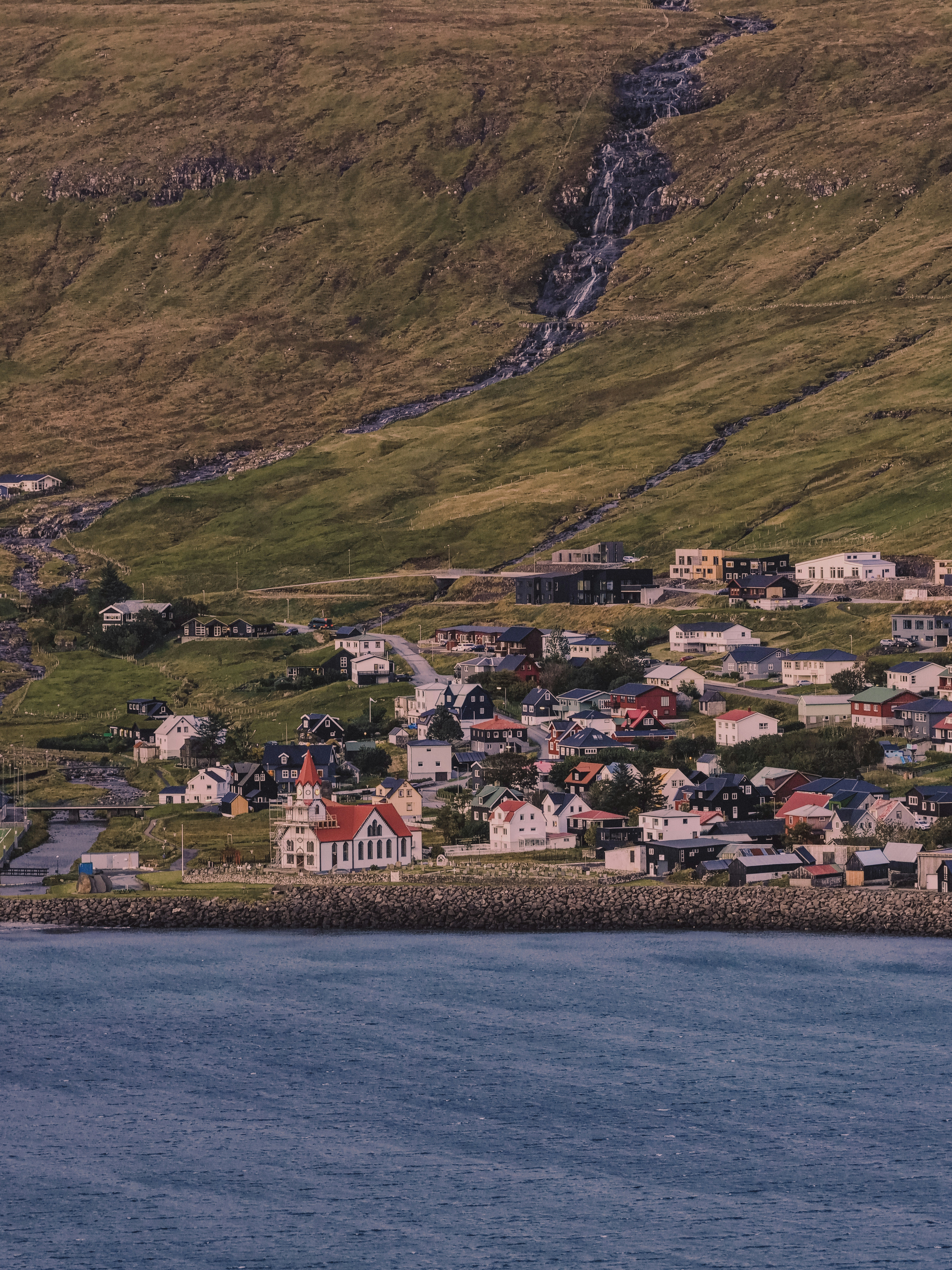 Red Church by the Shore: A Quiet Coastal Hamlet Hidden in Emerald Hills