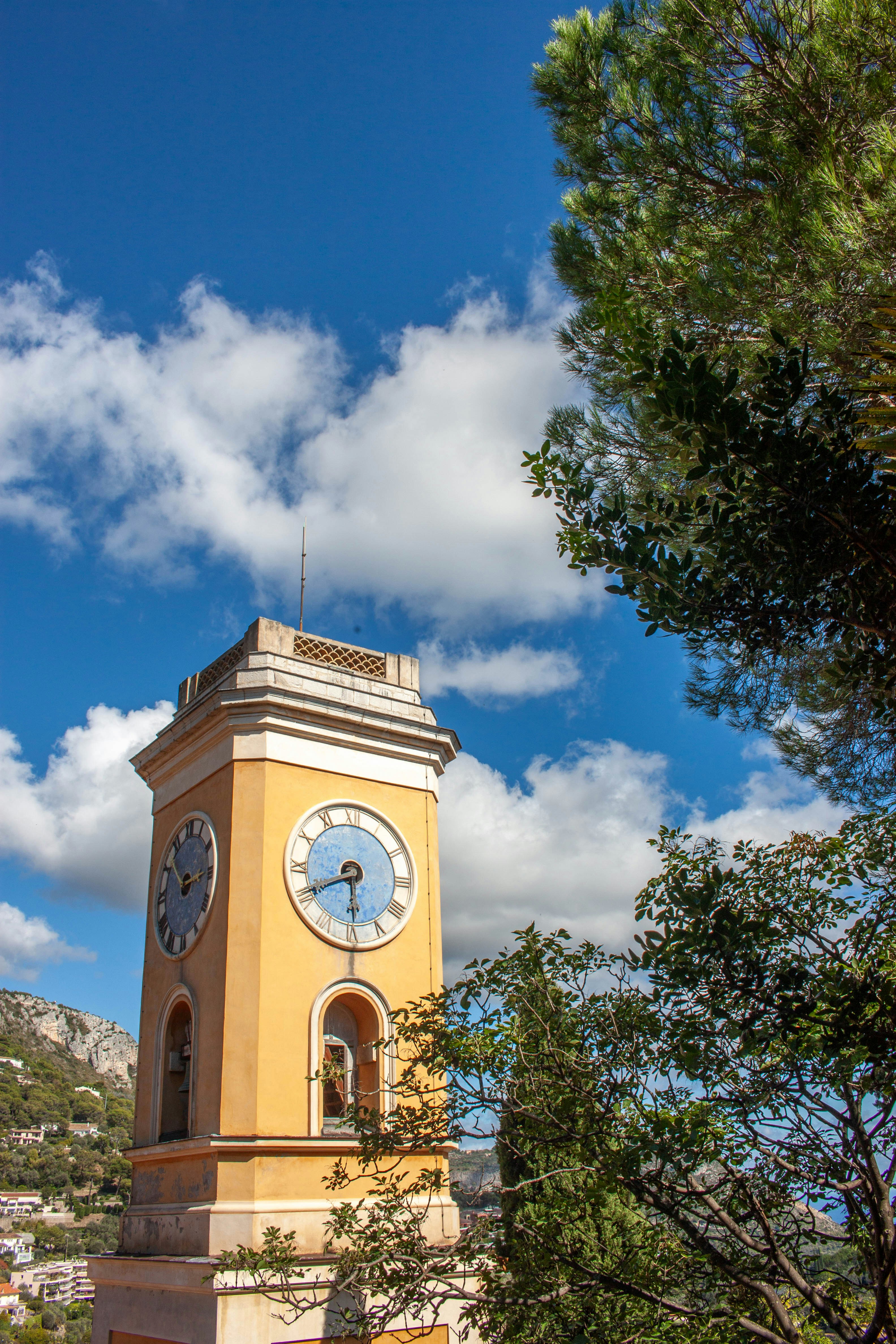 Yellow clock tower against blue sky with clouds photo – Free ...