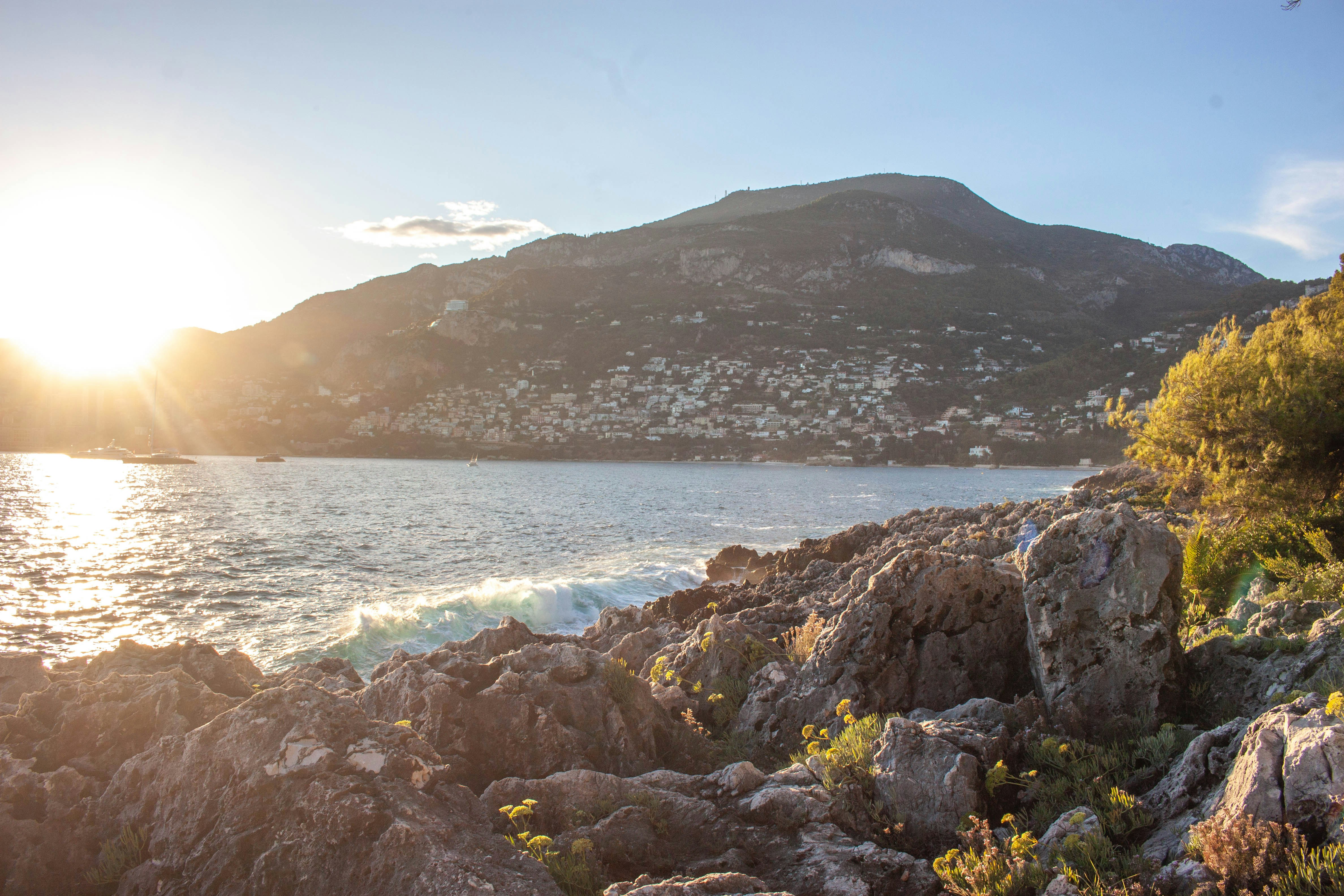 Sunlit Ridge over a Quiet Sea at Golden Hour