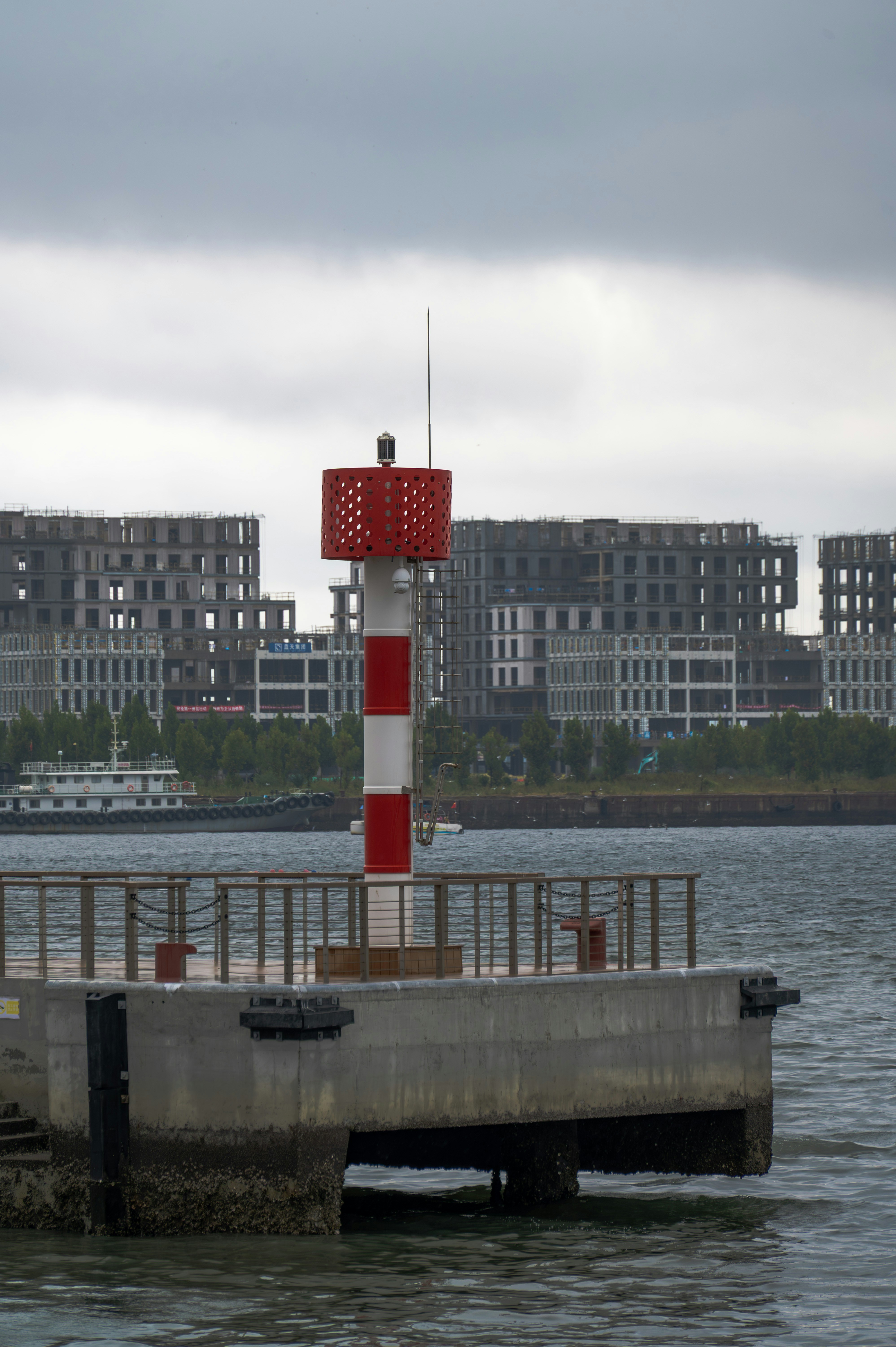Beacon of Transition: A Pier Amidst Urban Development