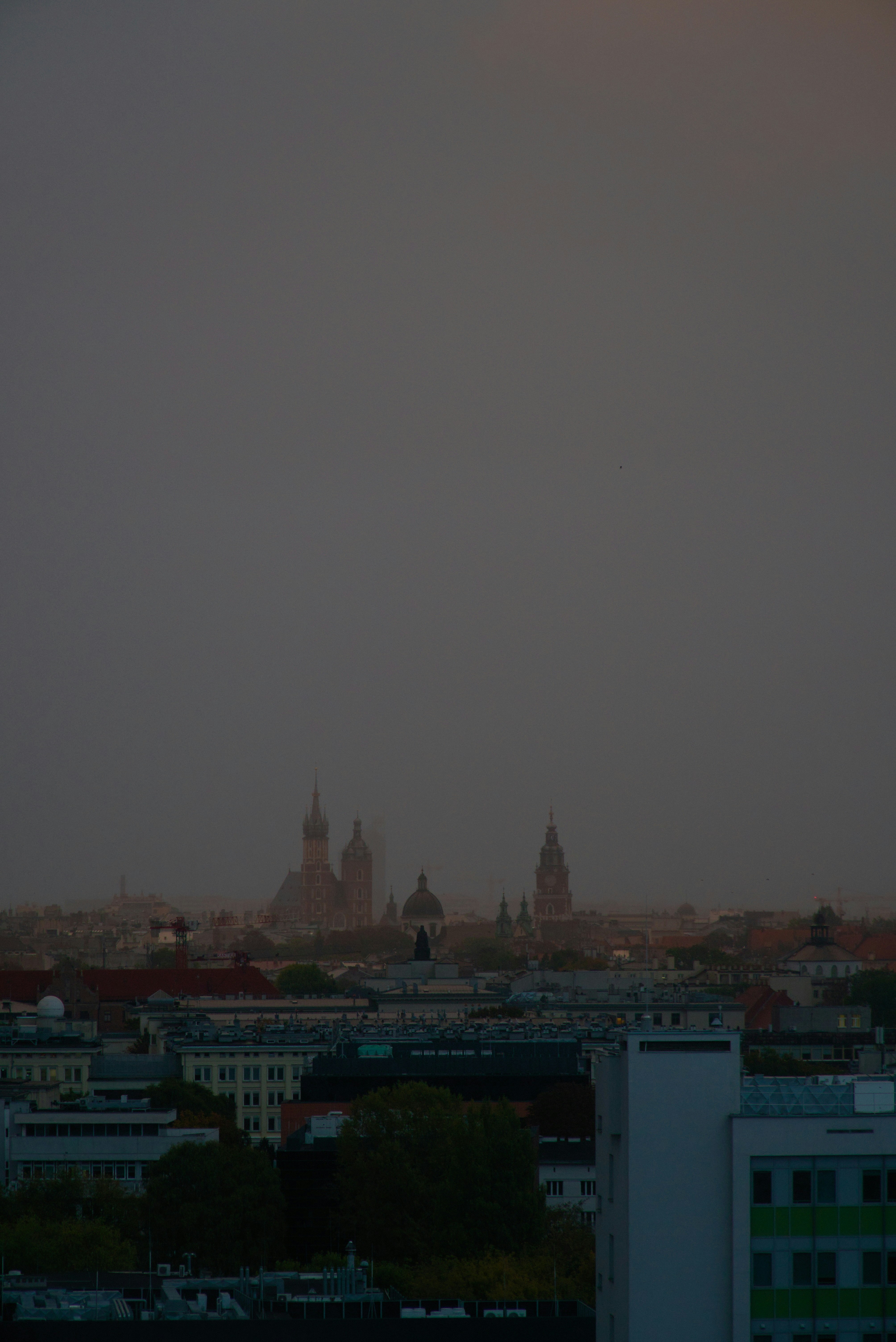 City skyline with historic buildings at dusk